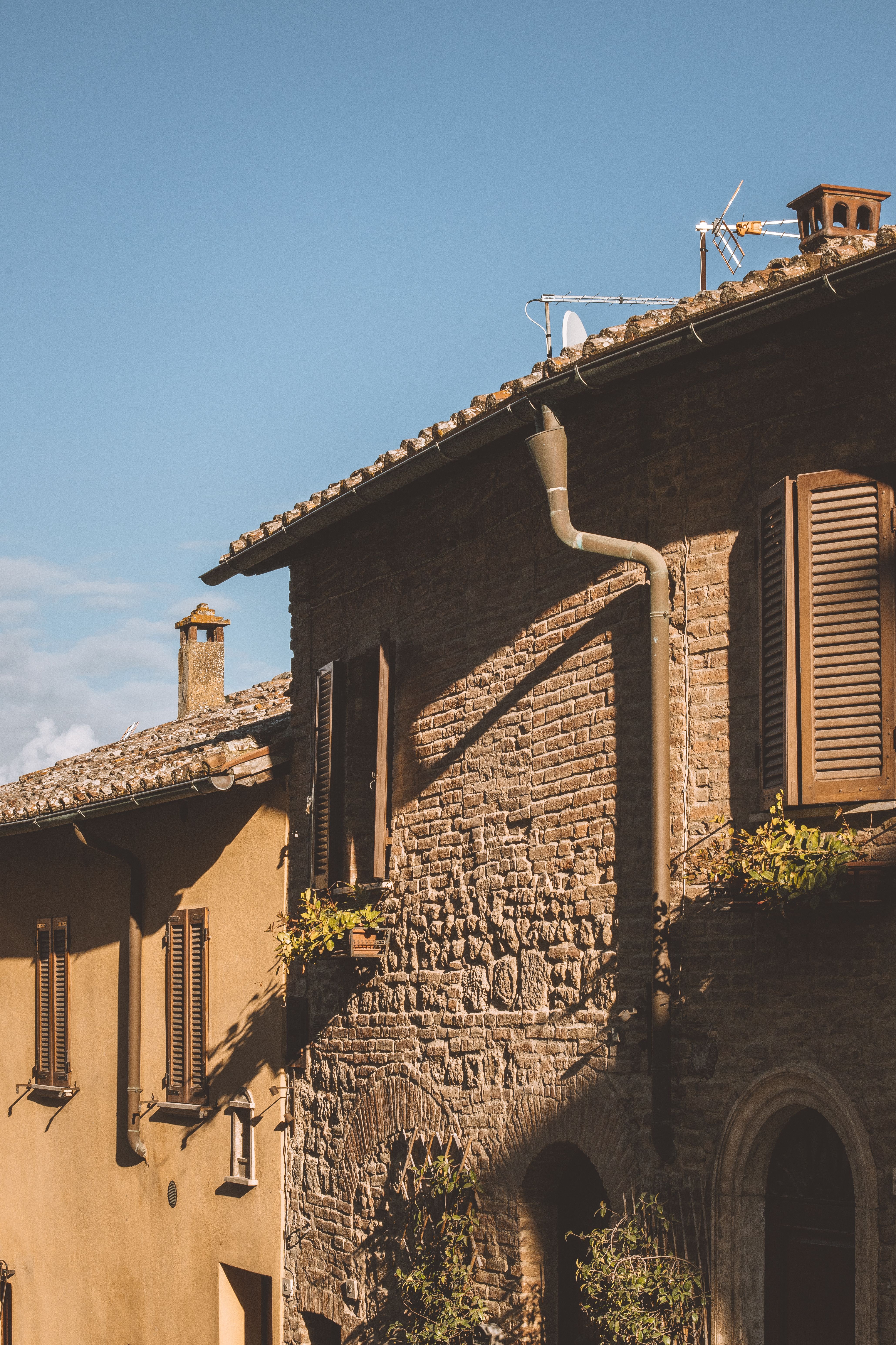 Rustic Italian Architecture under Blue Sky · Free Stock Photo
