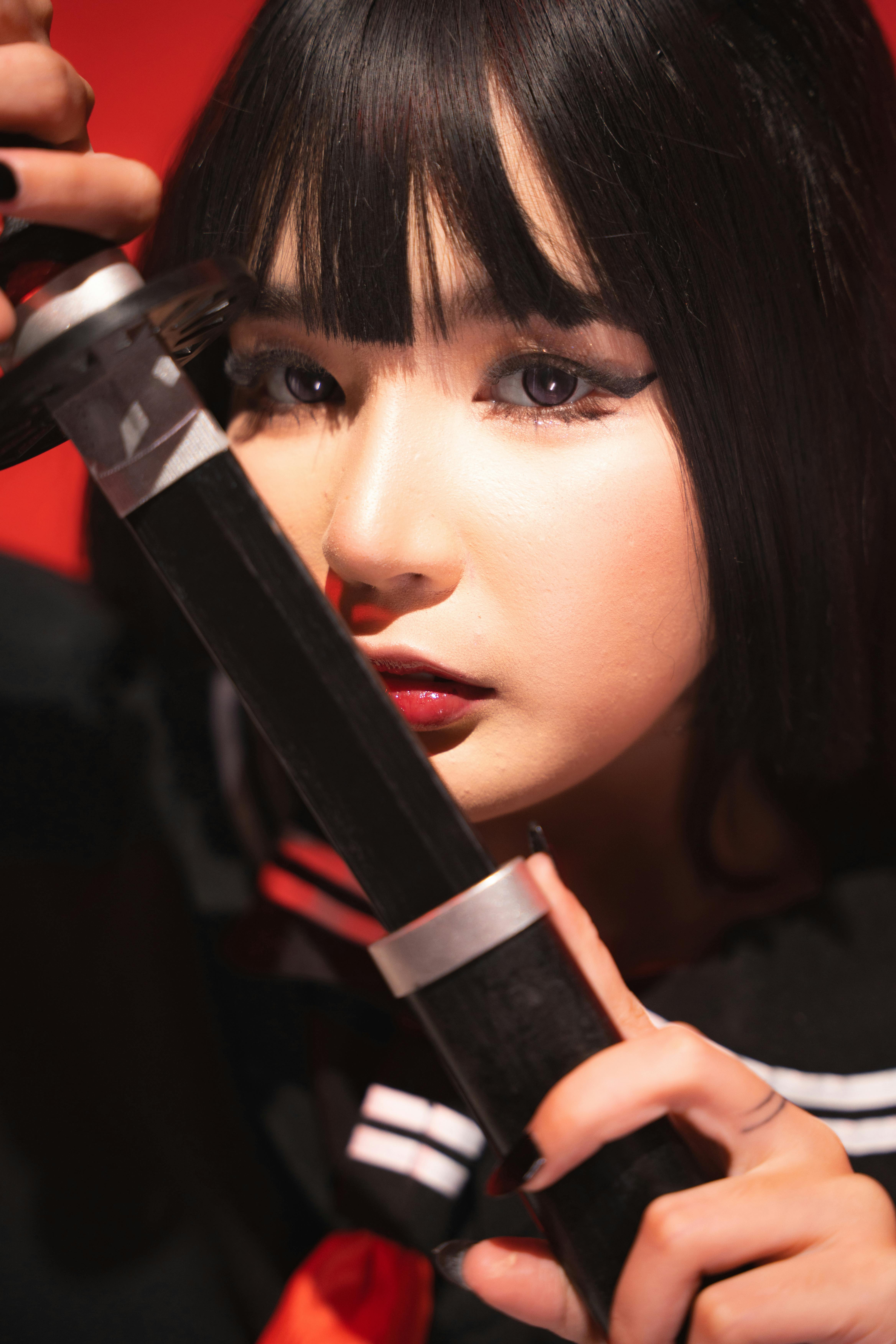 Stylish Portrait of a Woman with Sword · Free Stock Photo