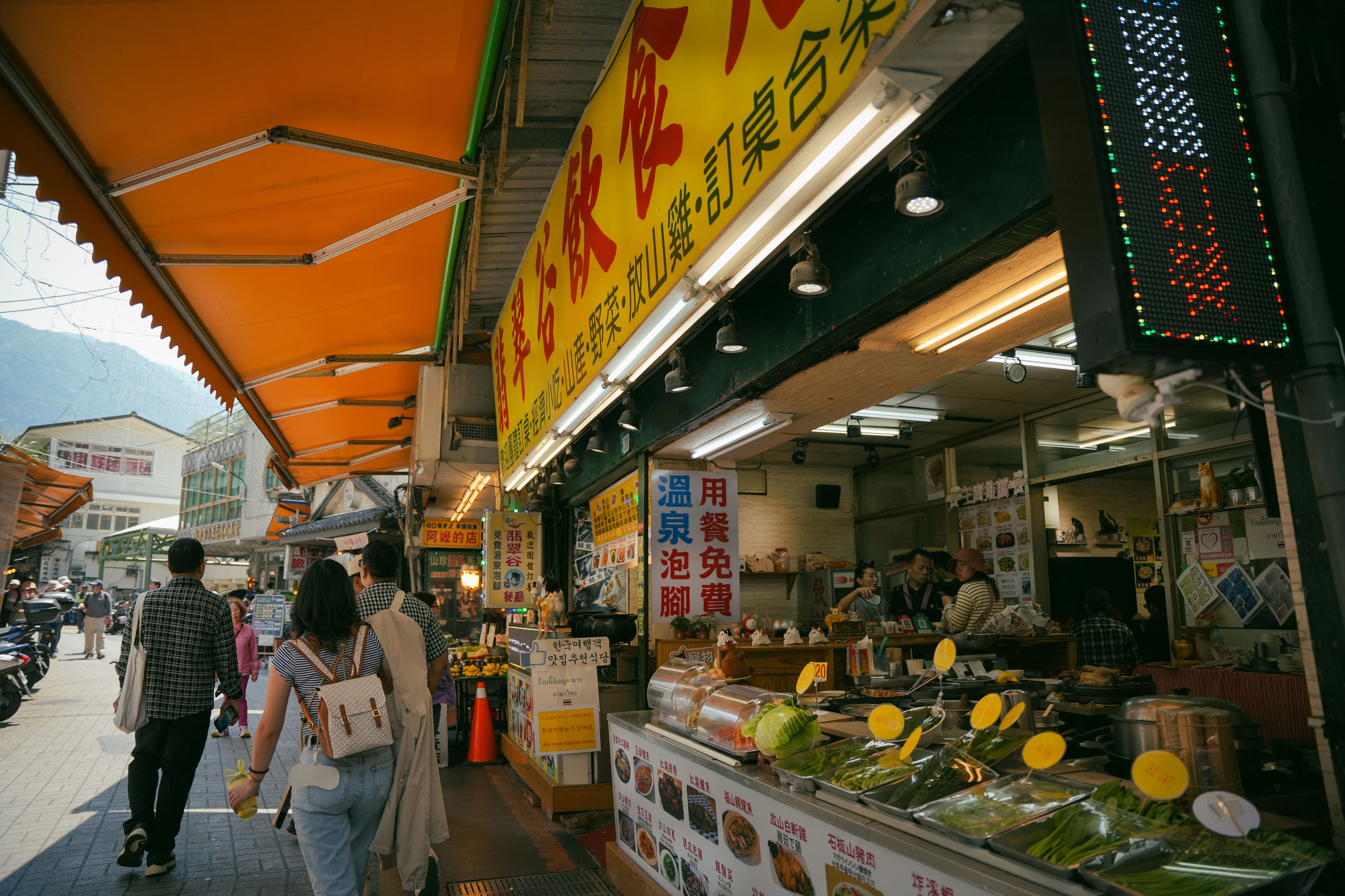 Bustling Asian Street Market with Food Stalls · Free Stock Photo