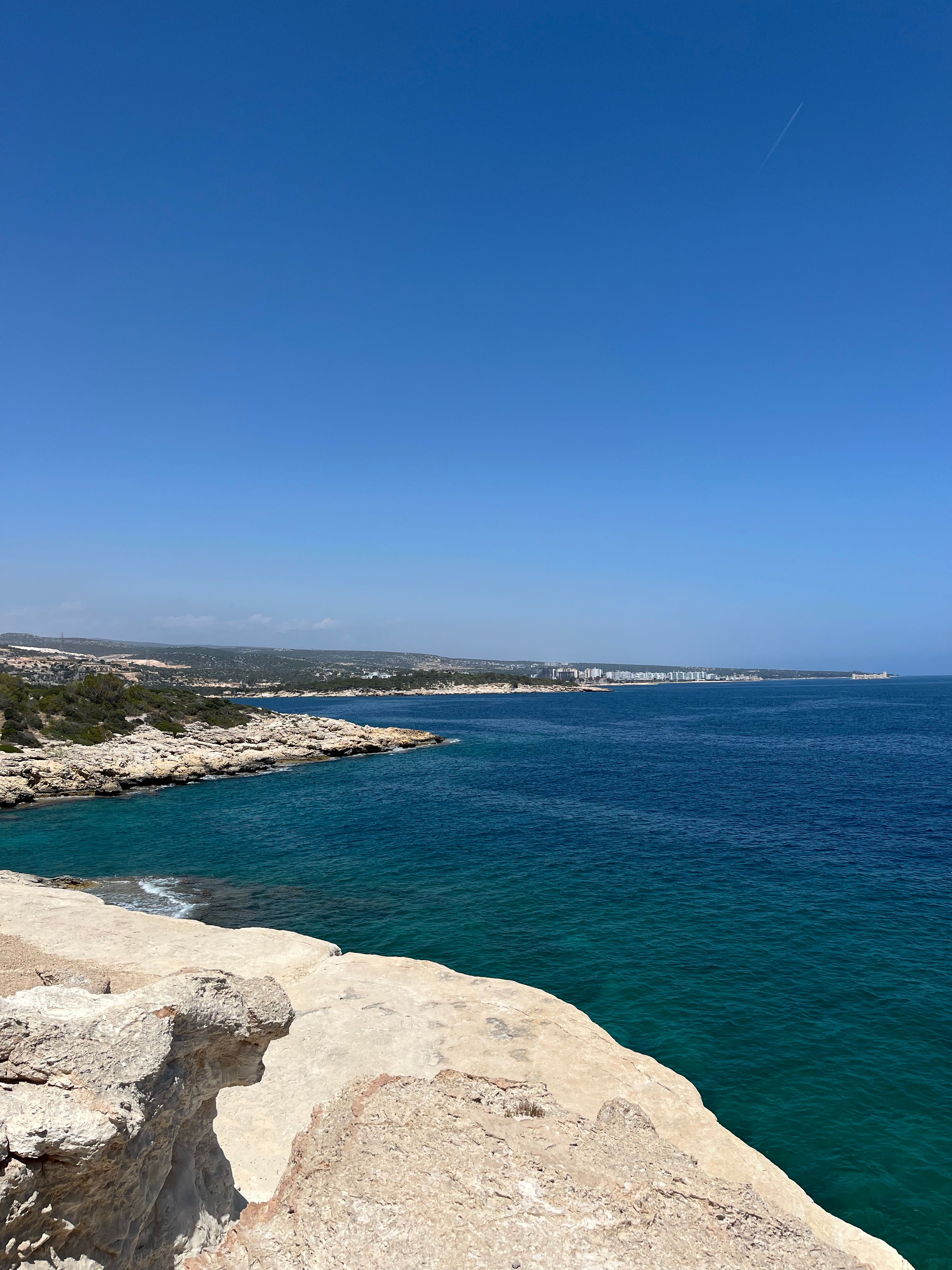 Scenic Coastal View of Rocky Mediterranean Shoreline · Free Stock Photo