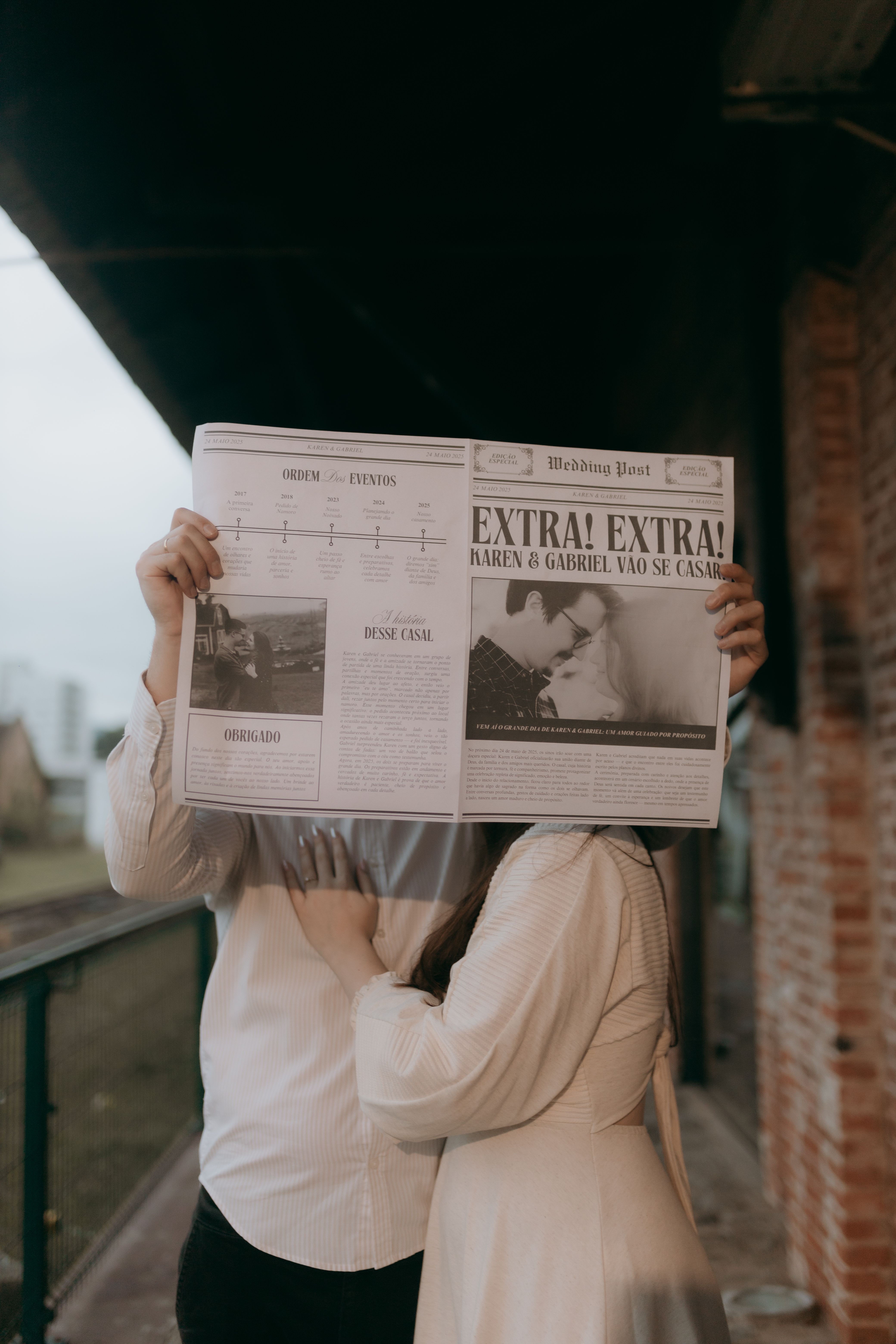 Romantic Couple Hiding Behind Newspaper Outdoors · Free Stock Photo