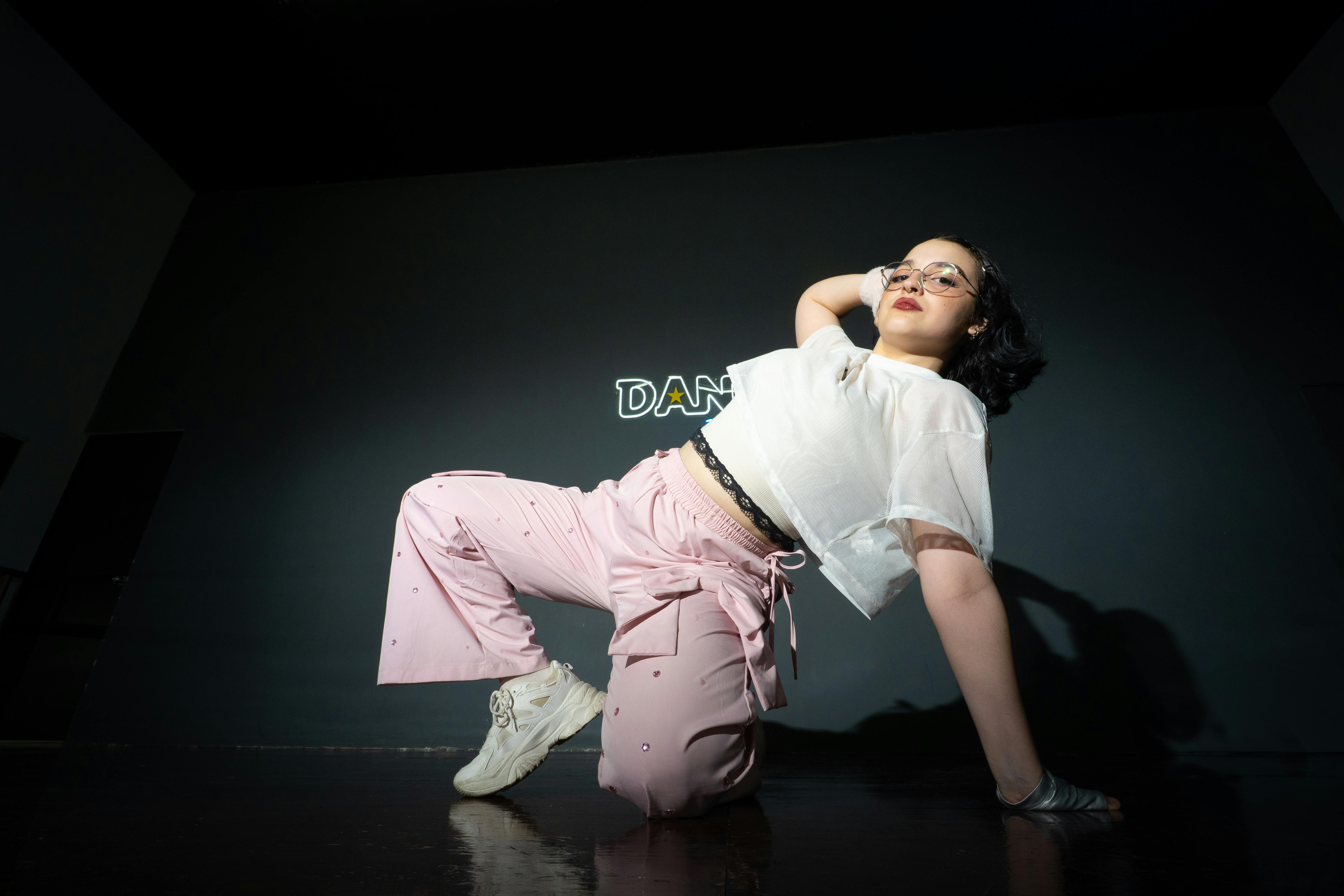 Dynamic Dance Pose in Studio Setting · Free Stock Photo