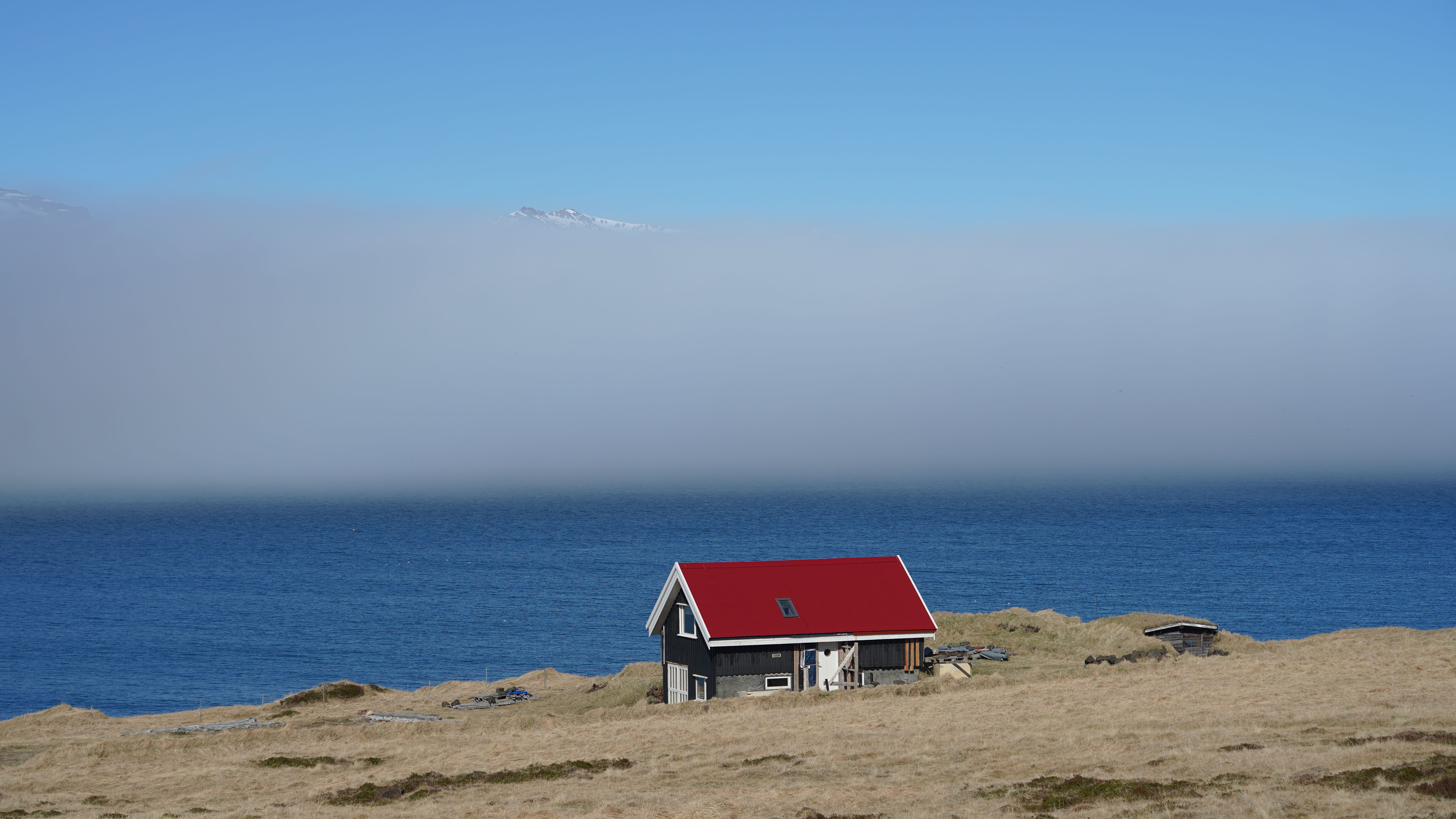 Scenic Icelandic Coastal Cabin with Misty Background · Free Stock Photo