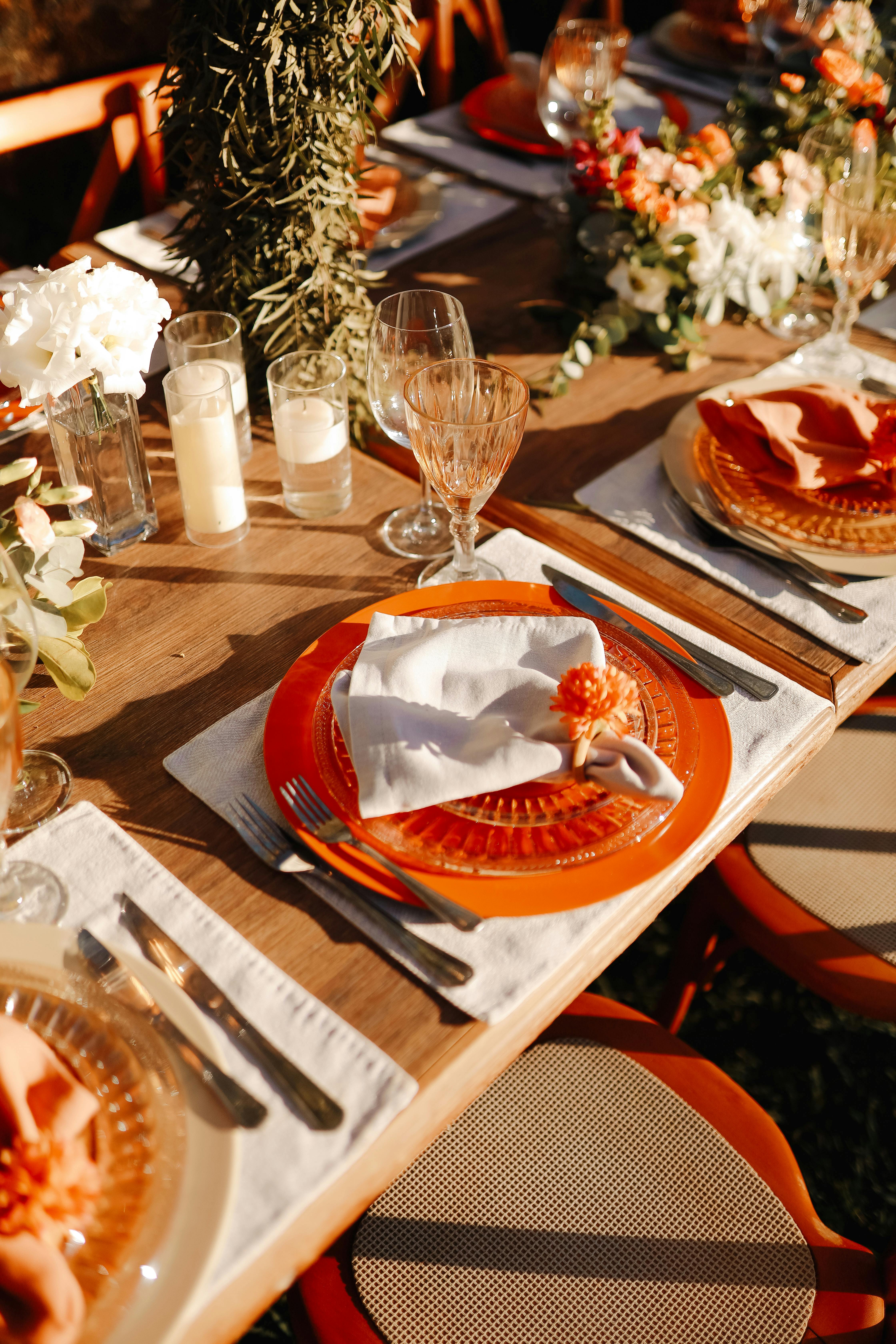 Elegant Outdoor Dining Table Setup at Sunset · Free Stock Photo