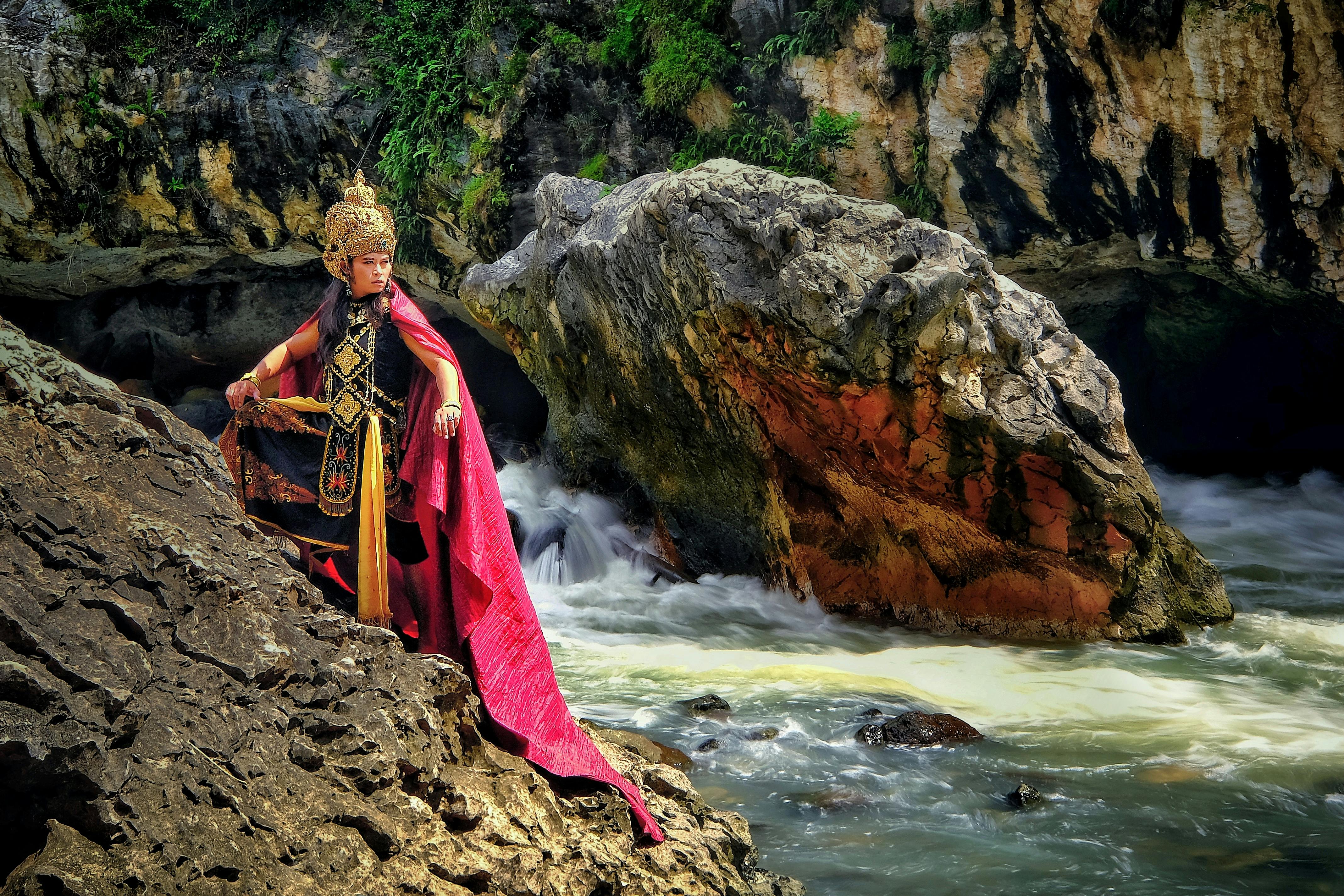 Traditional Javanese Costume by River Rocks · Free Stock Photo