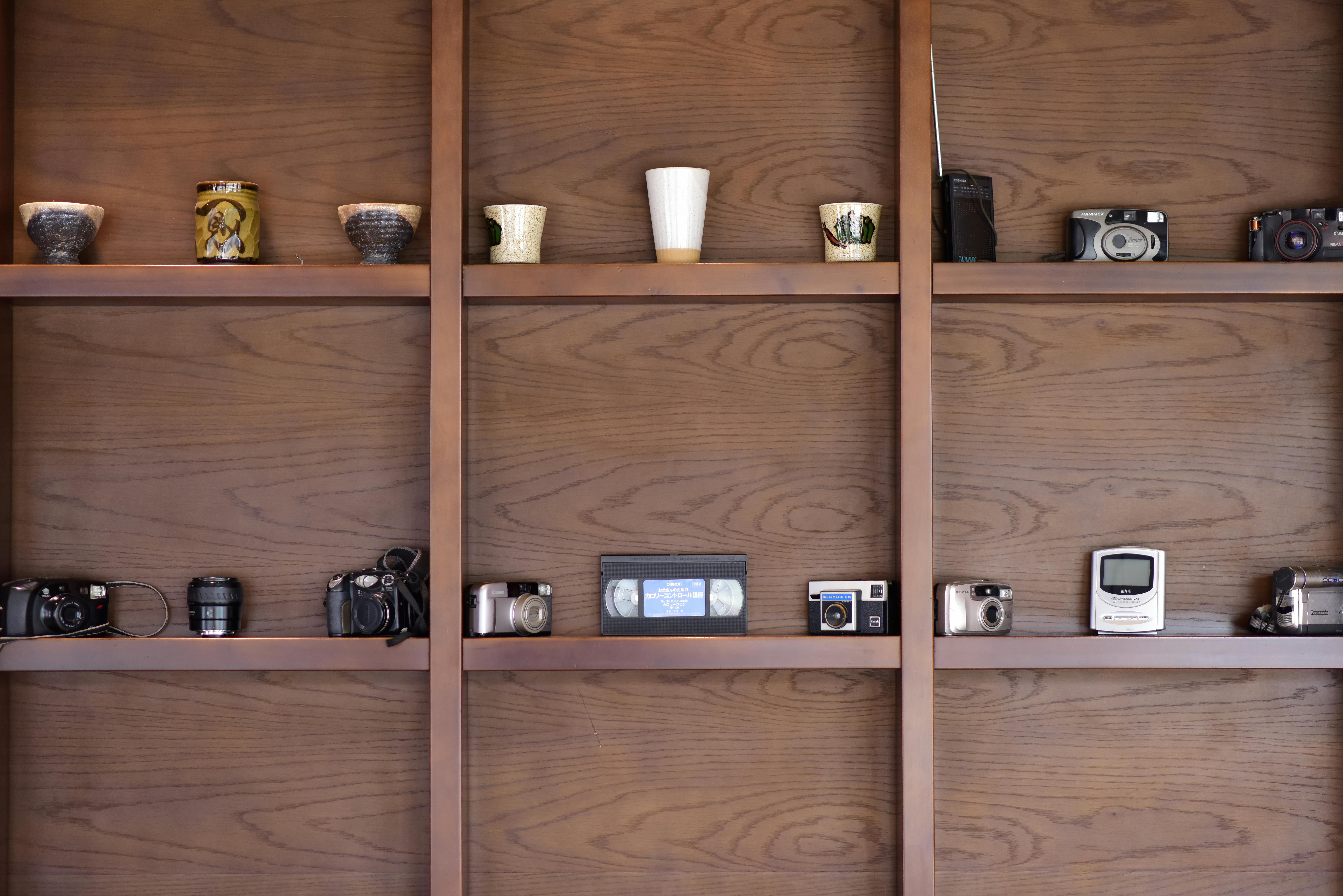 Vintage Cameras and Pottery Display on Wooden Shelf · Free Stock Photo