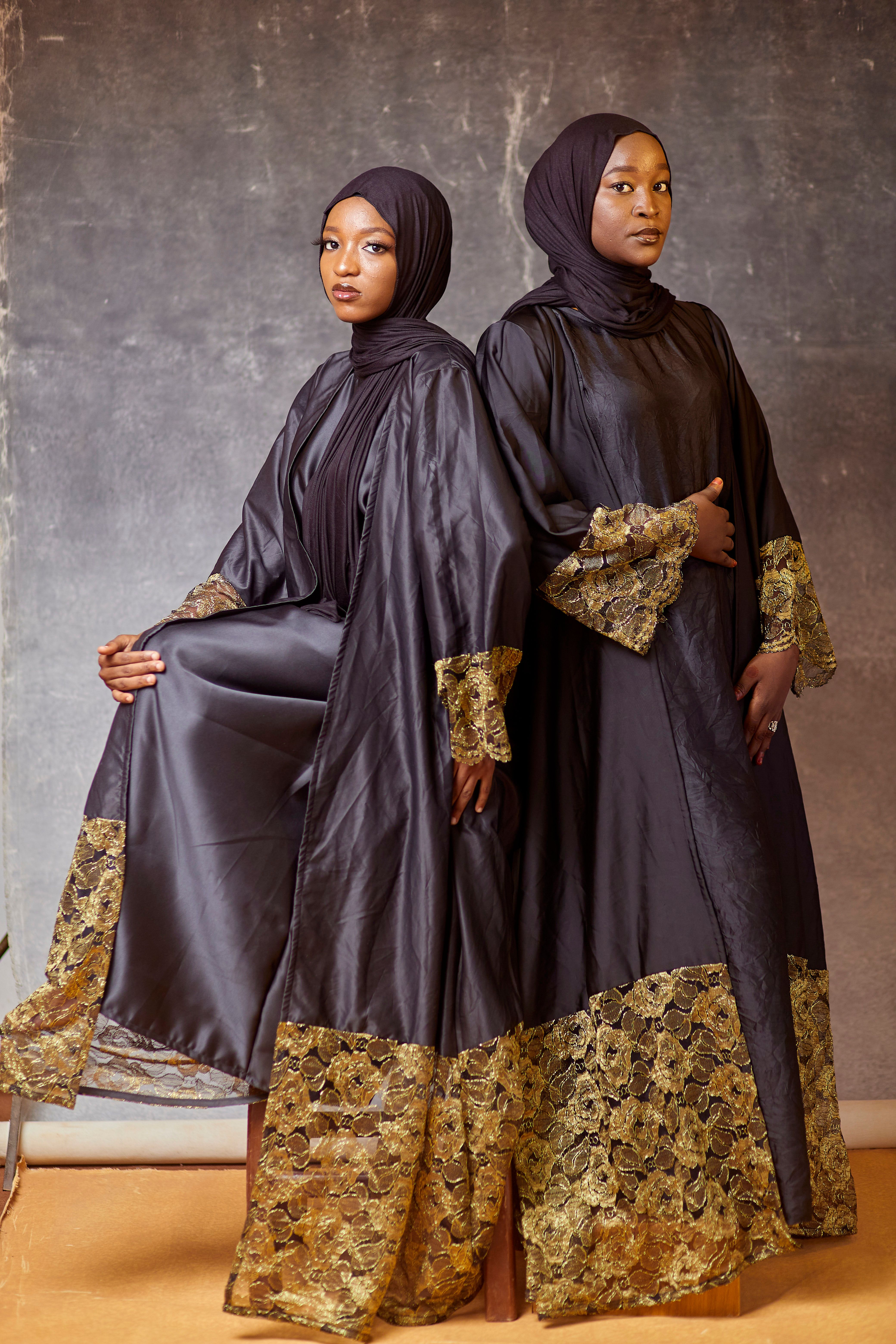 Elegant Portrait of Two Women in Traditional Attire · Free Stock Photo