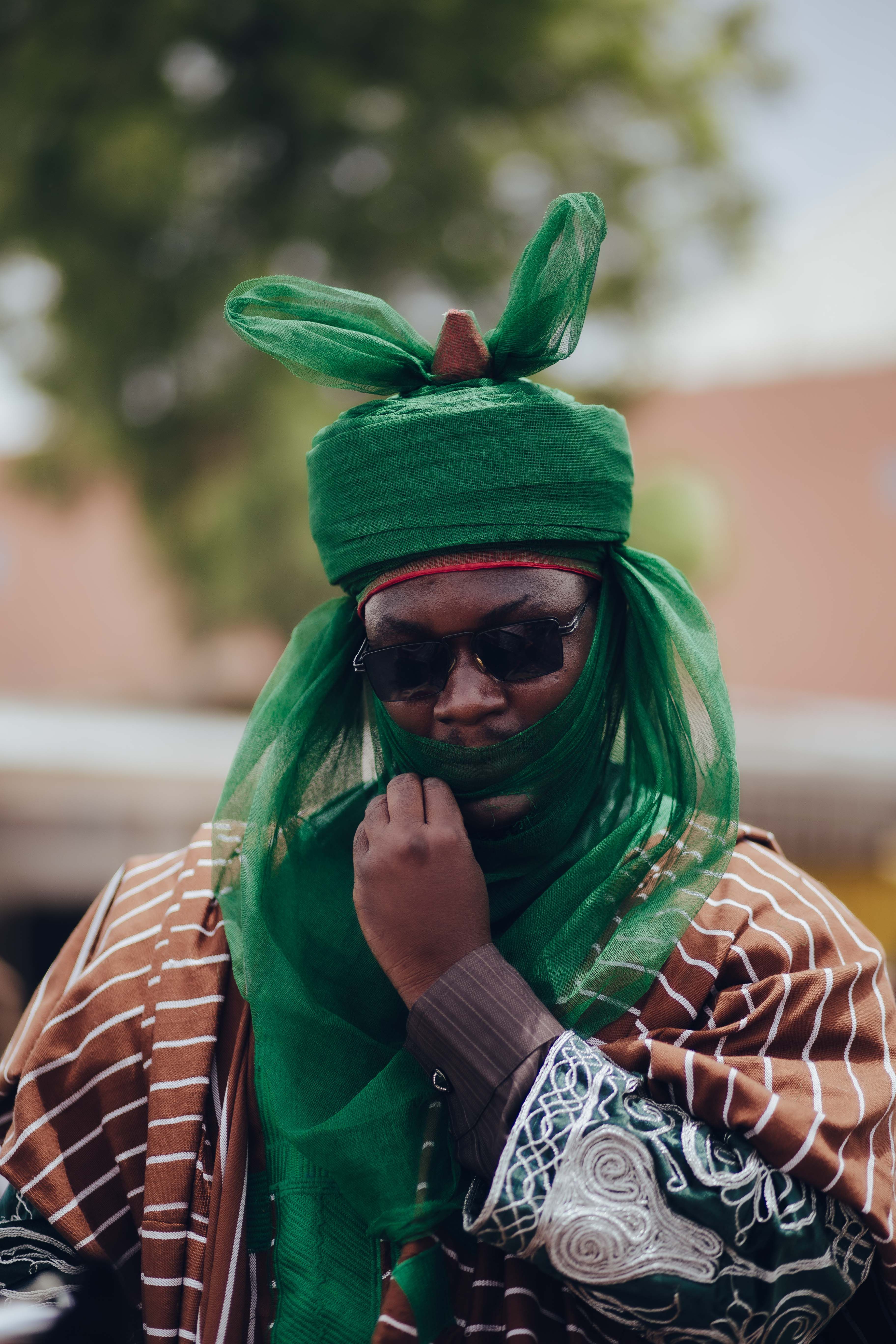 Traditional Cultural Attire with Green Headpiece · Free Stock Photo
