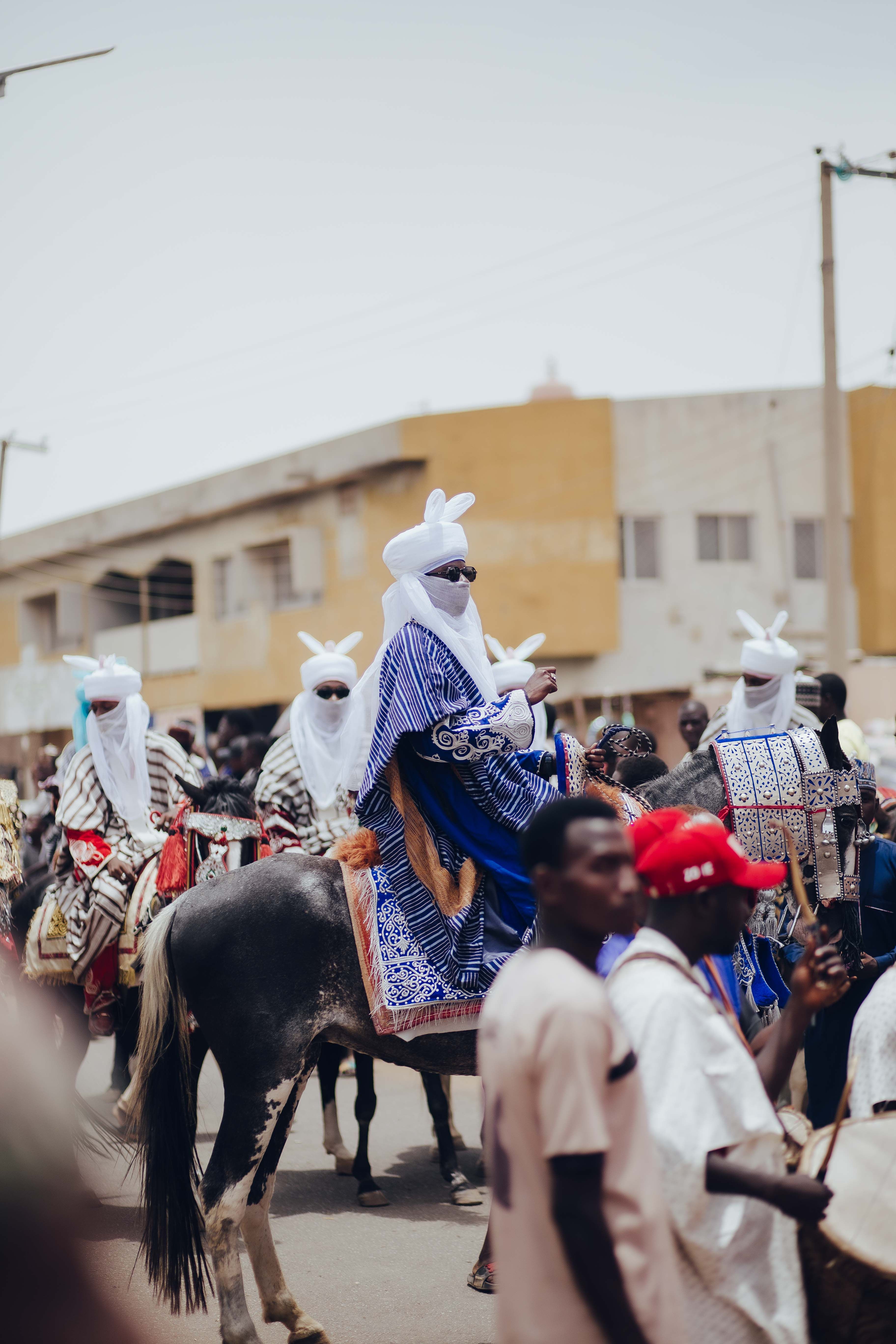 Traditional Horseback Riders in Festive Parade · Free Stock Photo
