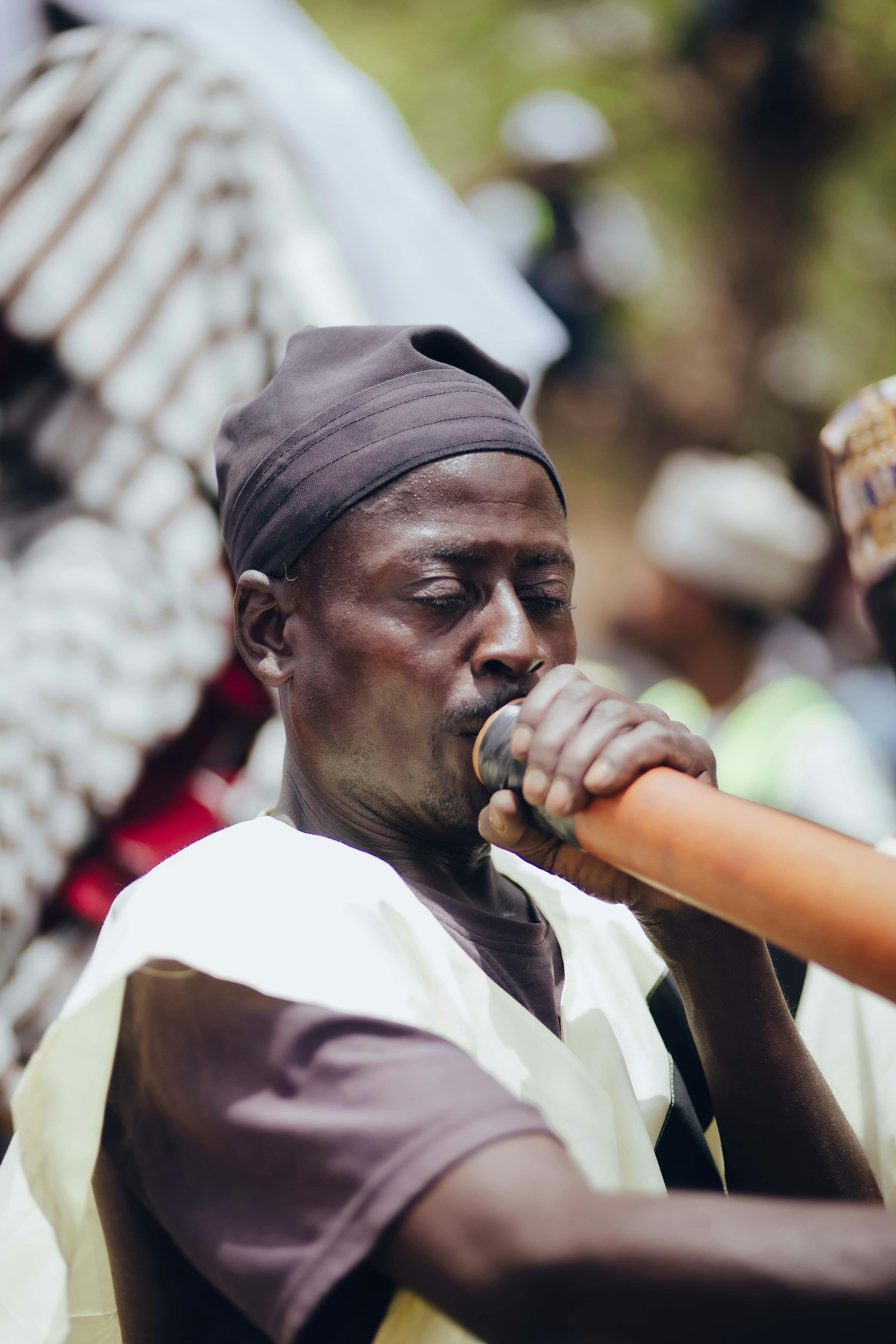 Nigerian Man Playing Traditional Wind Instrument · Free Stock Photo