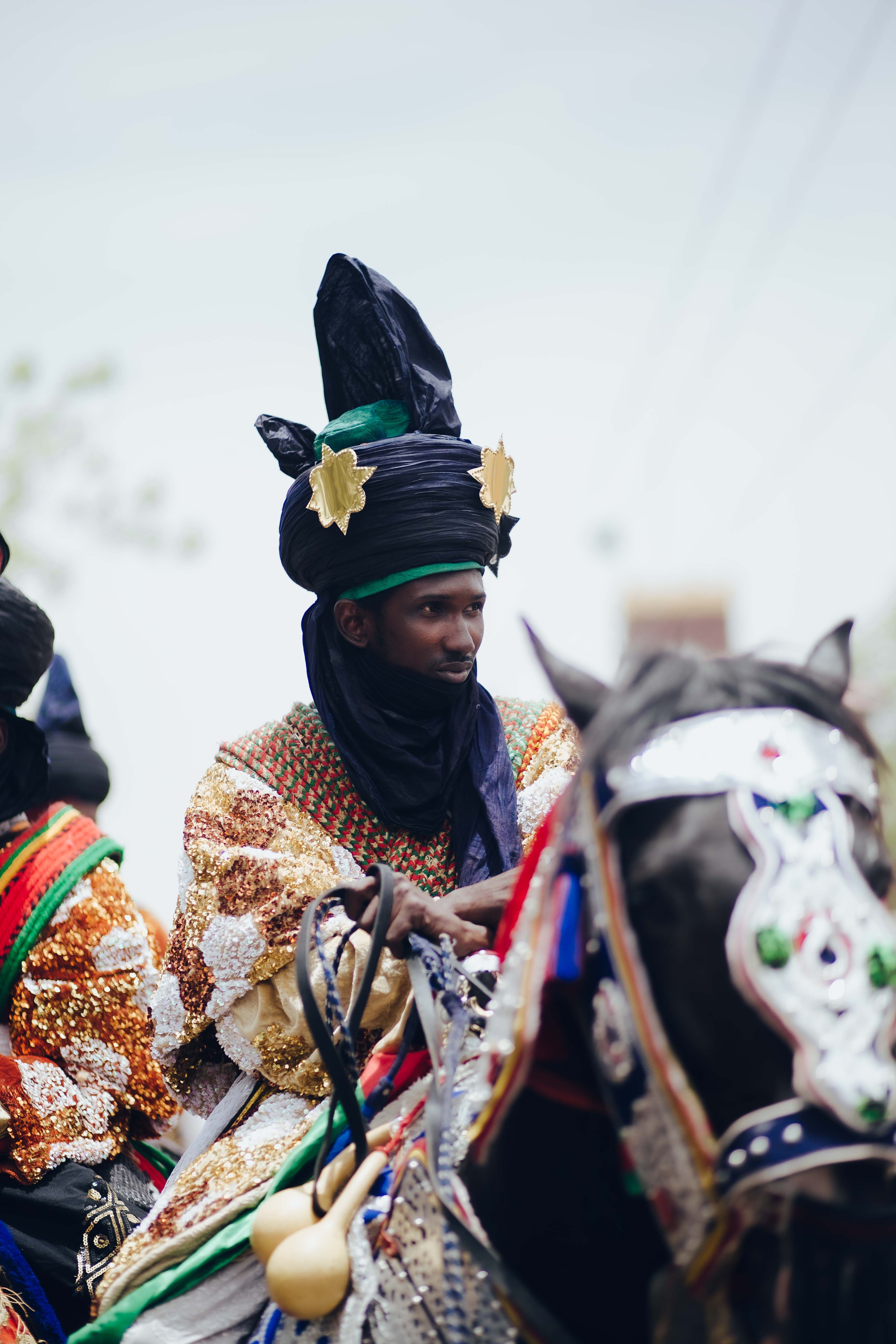 Traditional Hausa Horseman in Vibrant Regalia · Free Stock Photo