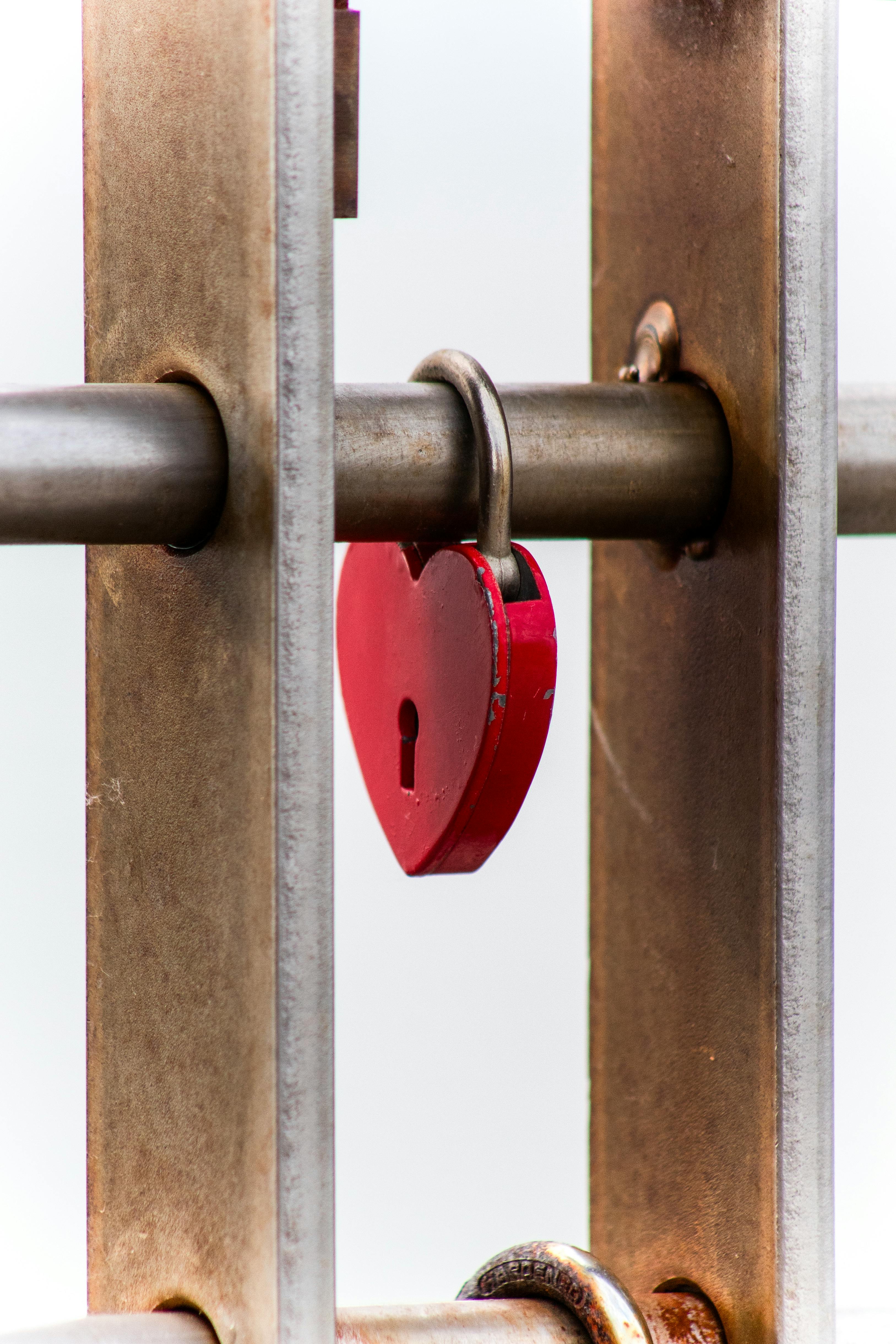 Red Heart Lock on Metal Bars in Grado, Italy · Free Stock Photo
