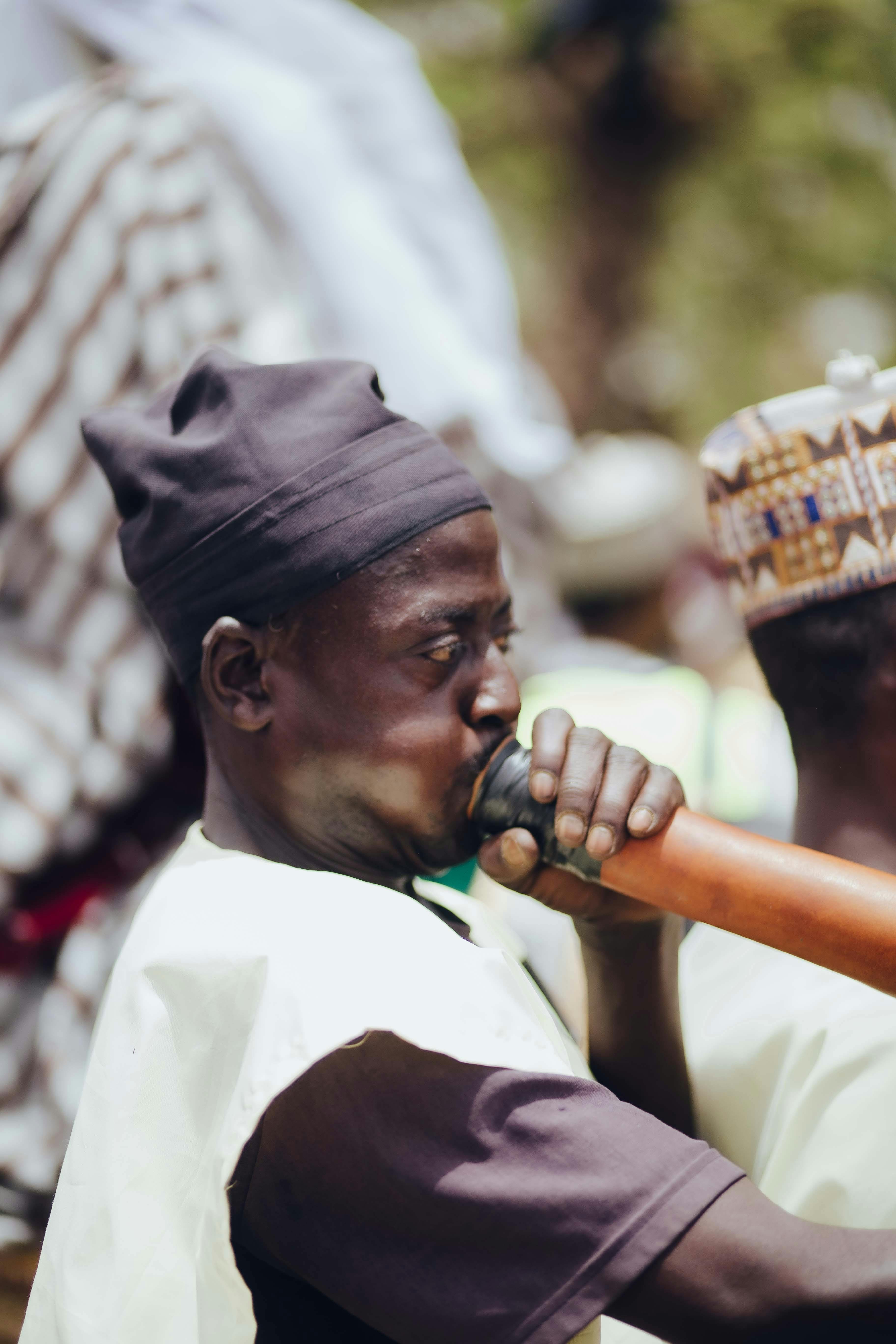 Traditional Nigerian Musician Blowing Horn · Free Stock Photo