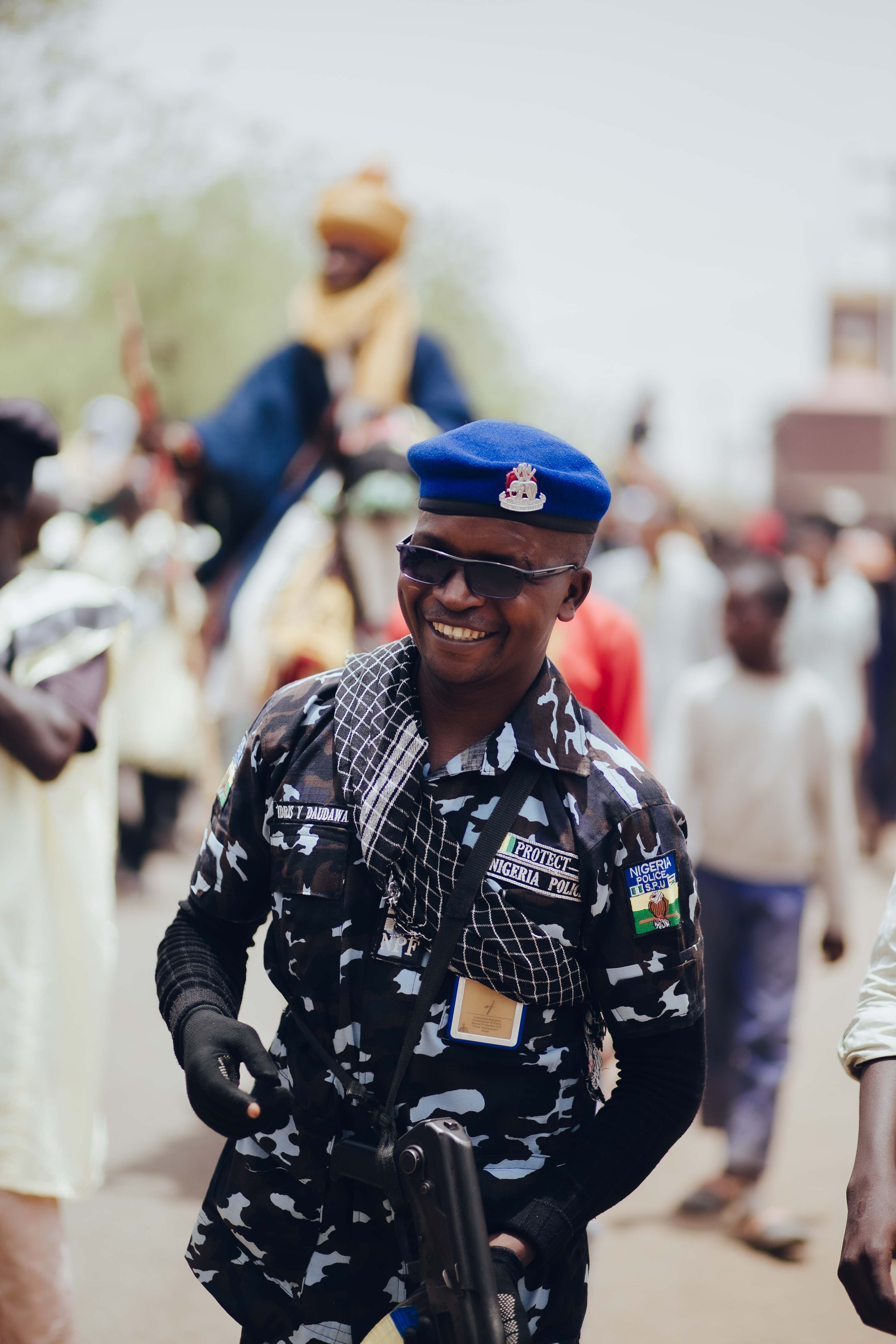 Nigerian Police Officer in Festive Street Parade · Free Stock Photo