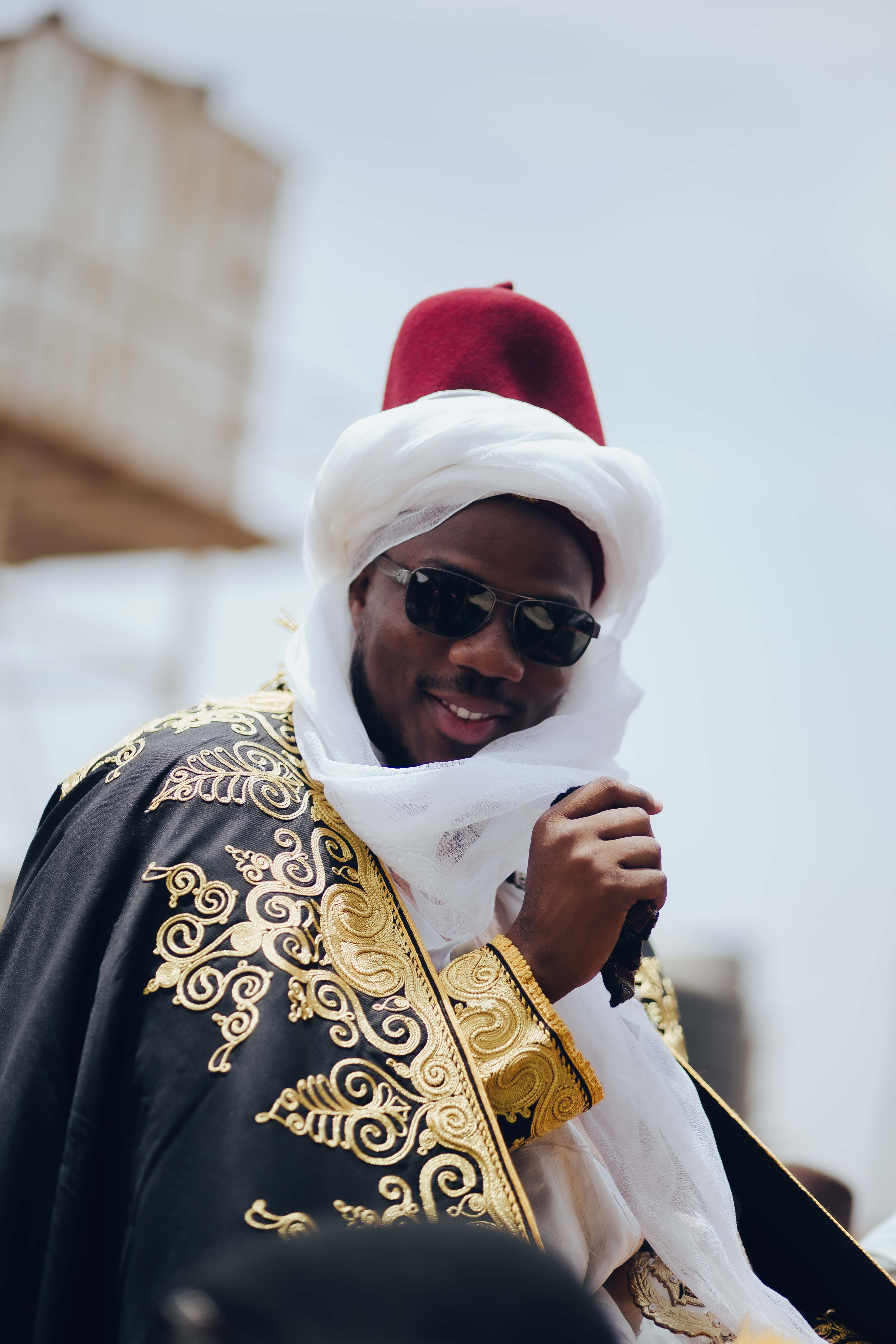 Traditional Nigerian Attire with Red Fez Hat · Free Stock Photo