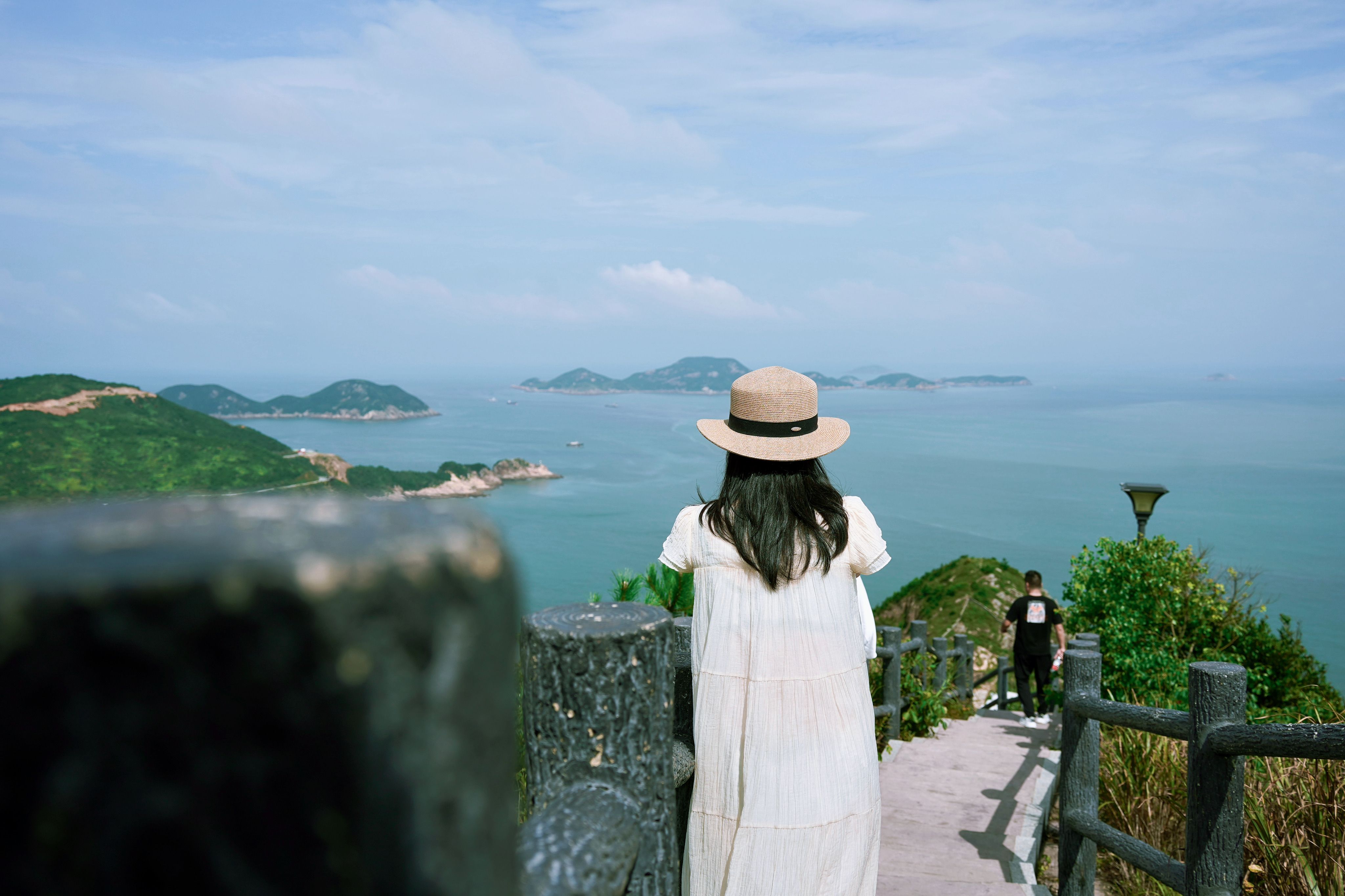 Woman Overlooking Scenic Coastal View · Free Stock Photo