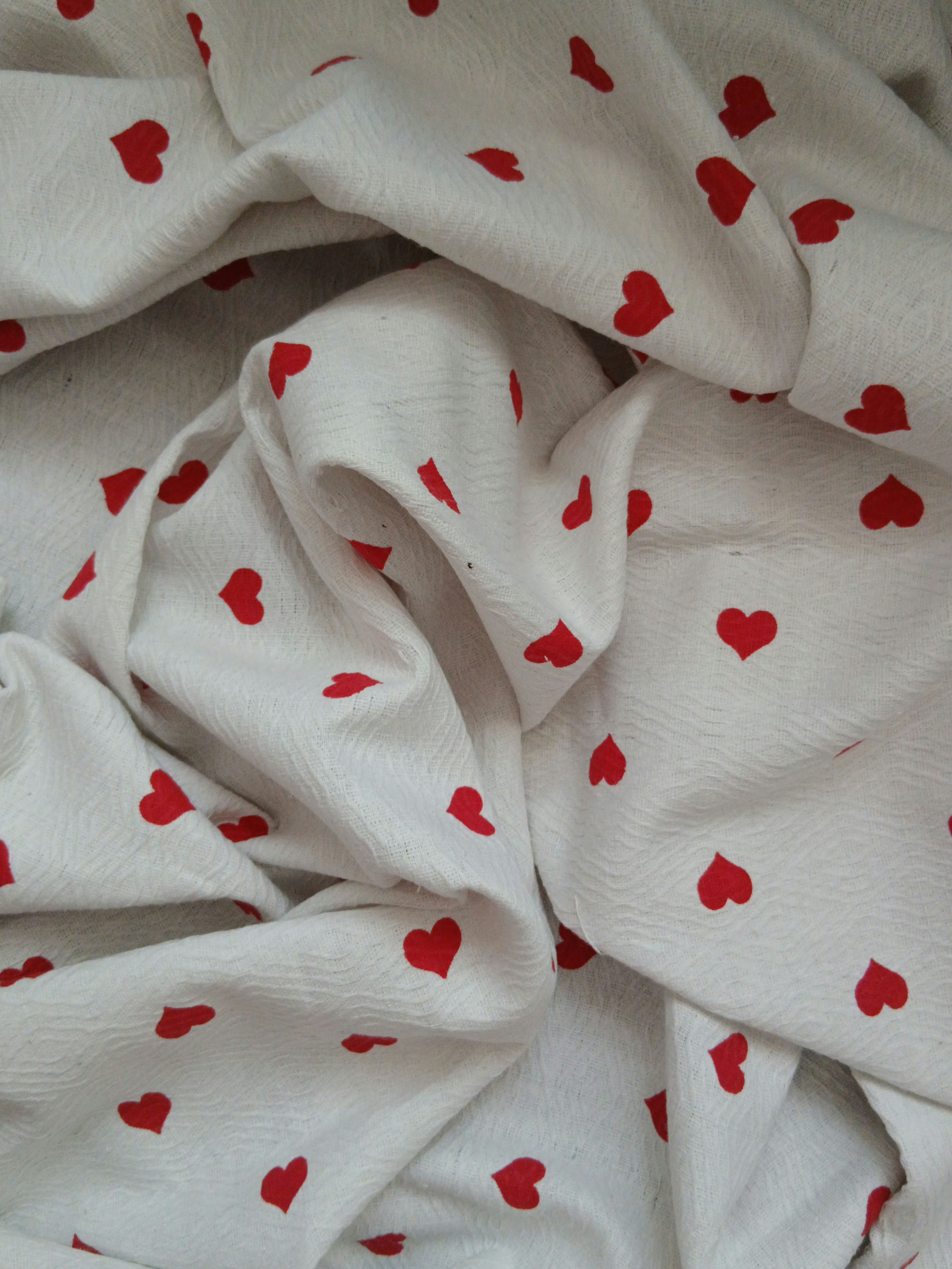 Wrinkled Fabric with Red Heart Patterns · Free Stock Photo