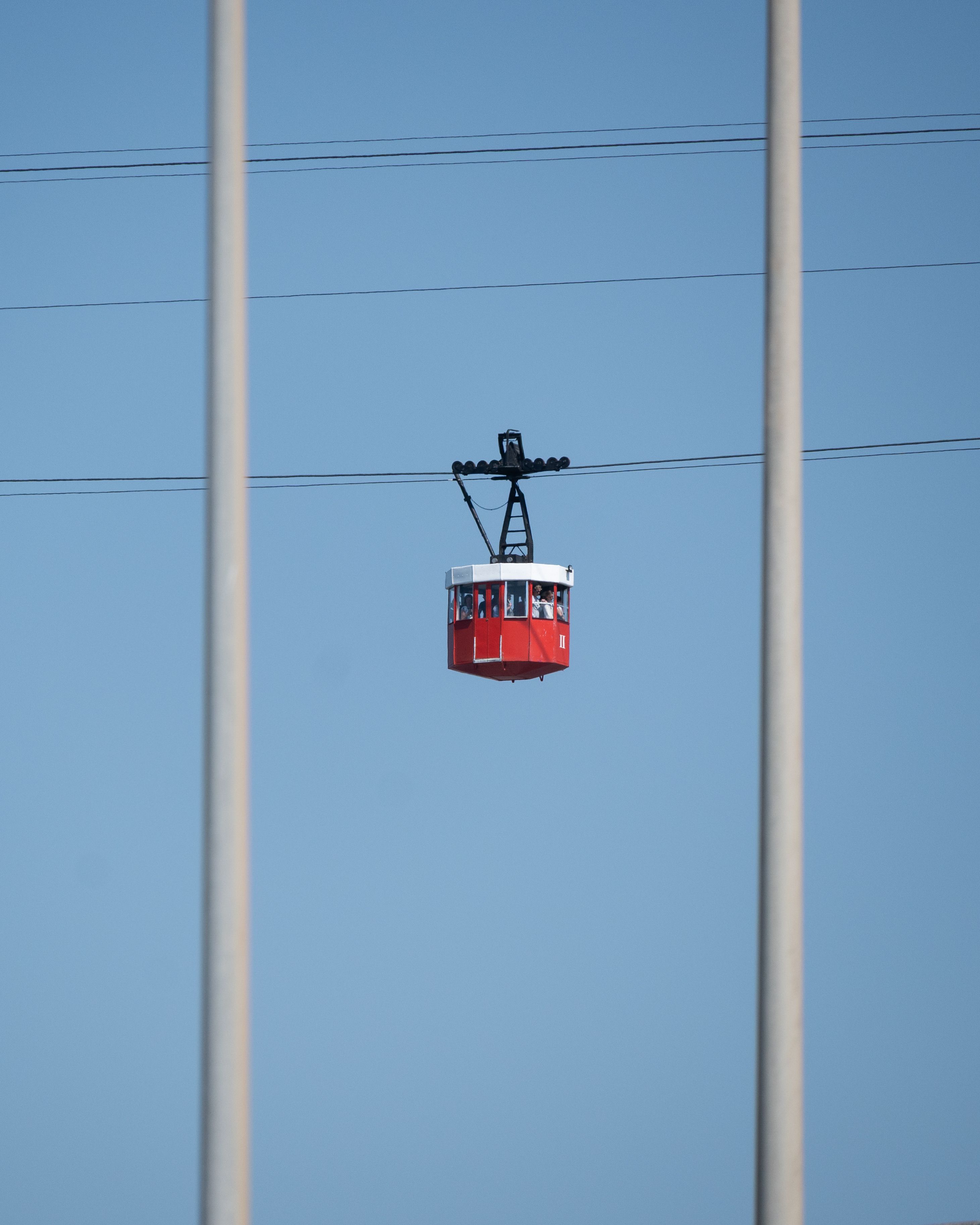 Red Cable Car Suspended in Blue Sky · Free Stock Photo