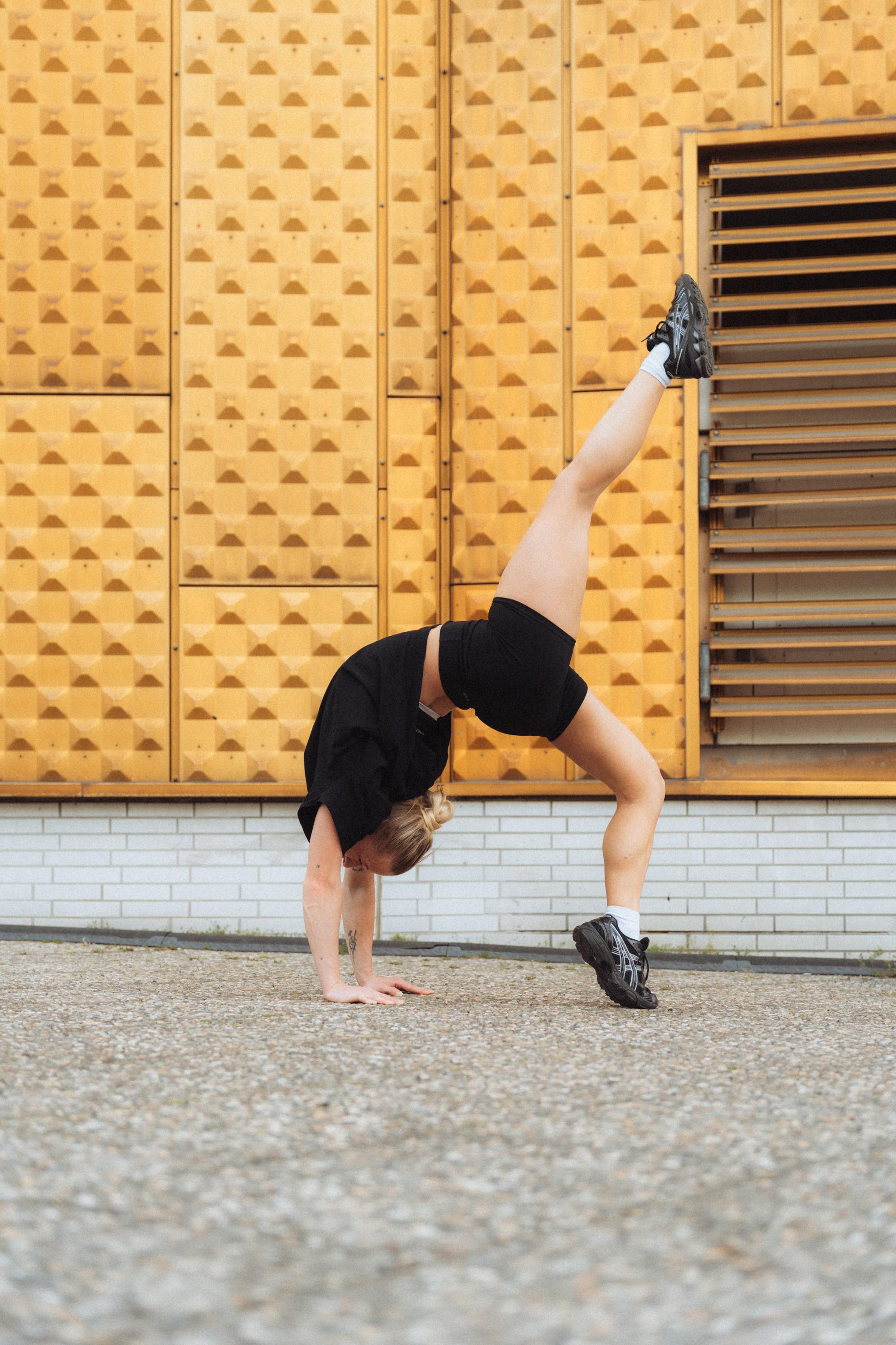 Urban Acrobatic Performance by a Young Woman · Free Stock Photo
