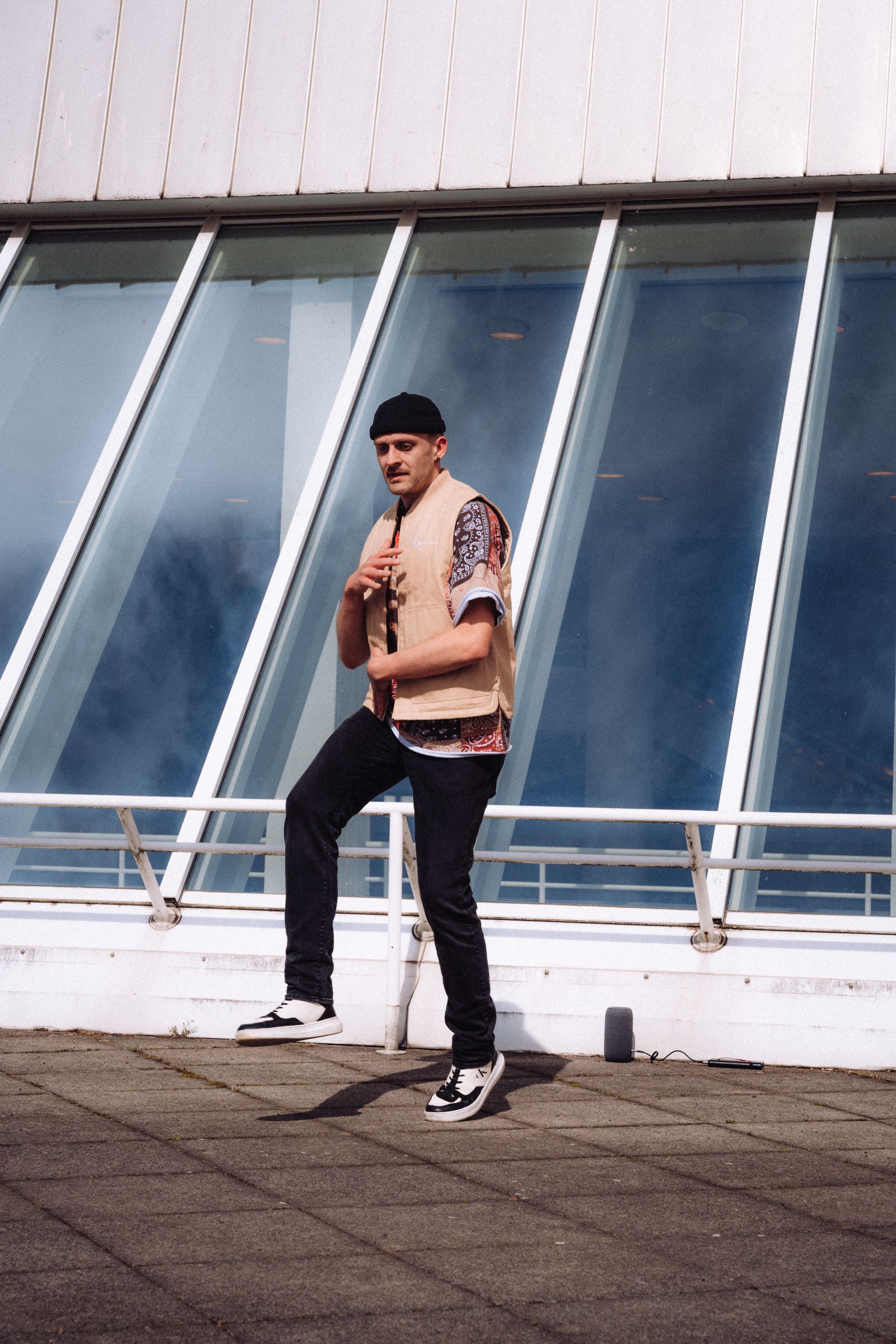 Stylish Man Posing Outside Modern Architecture · Free Stock Photo