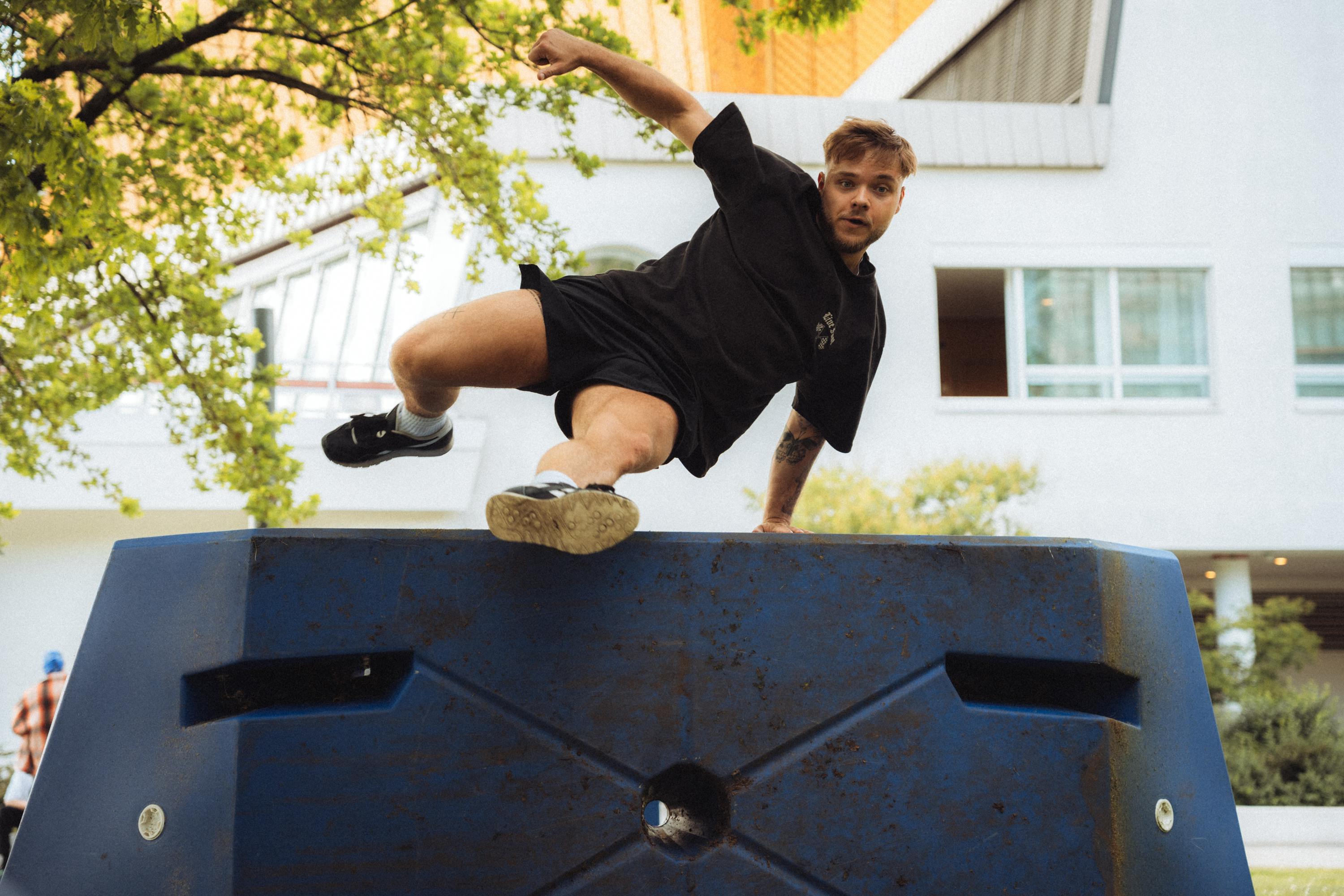 Dynamic Parkour Athlete Outdoors Performing Stunt · Free Stock Photo