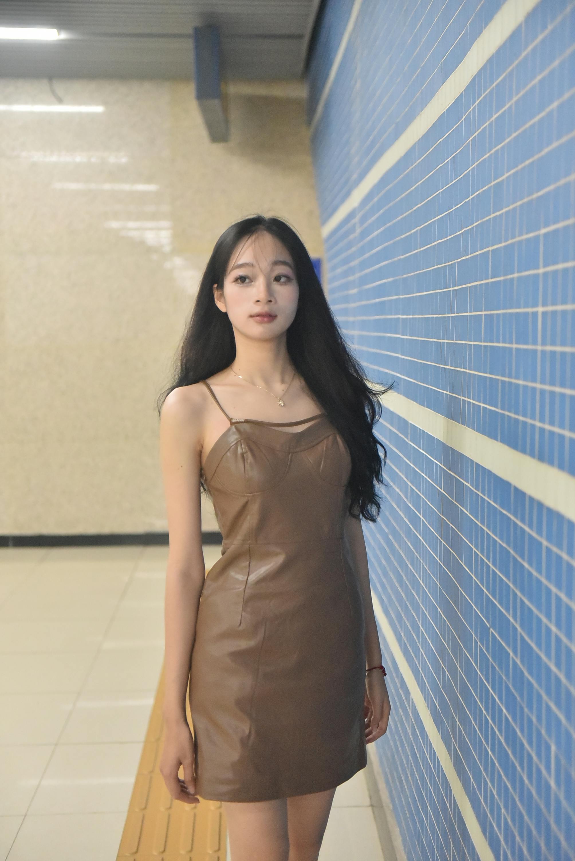 Elegant Woman in Urban Subway Setting · Free Stock Photo