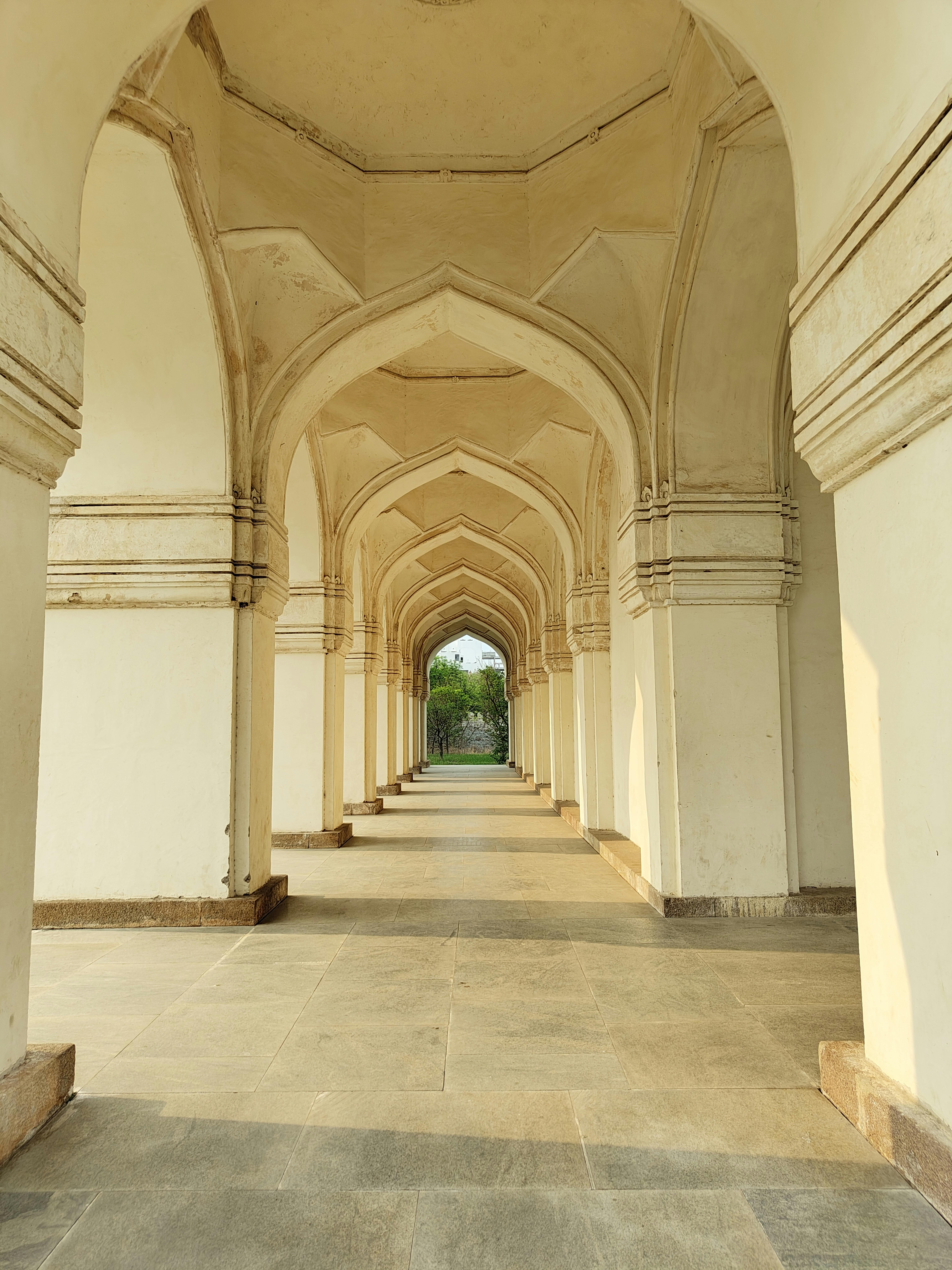 Majestic Architectural Corridor with Vaulted Arches · Free Stock Photo