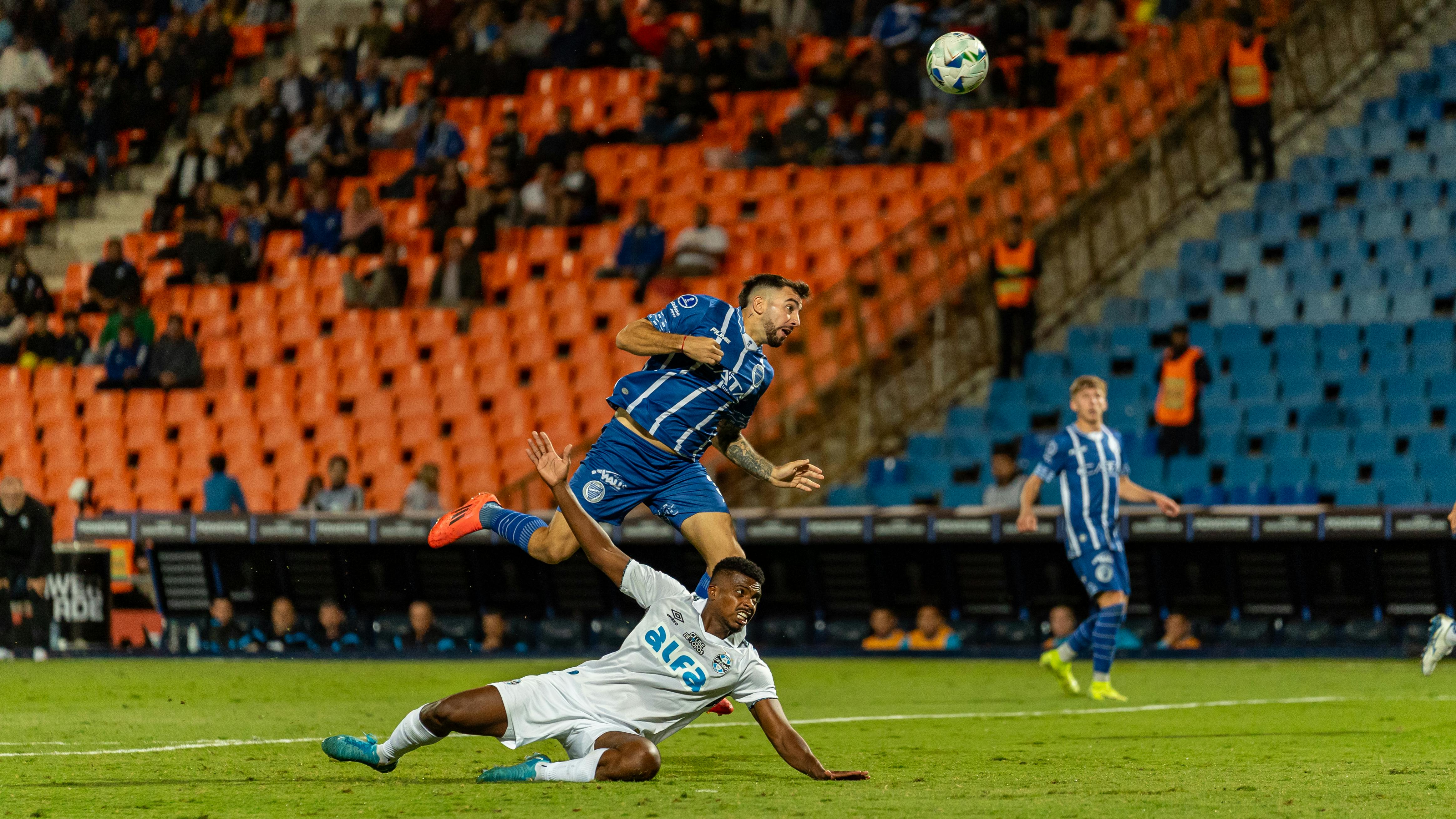 Intense Soccer Match with Dynamic Action Shot · Free Stock Photo