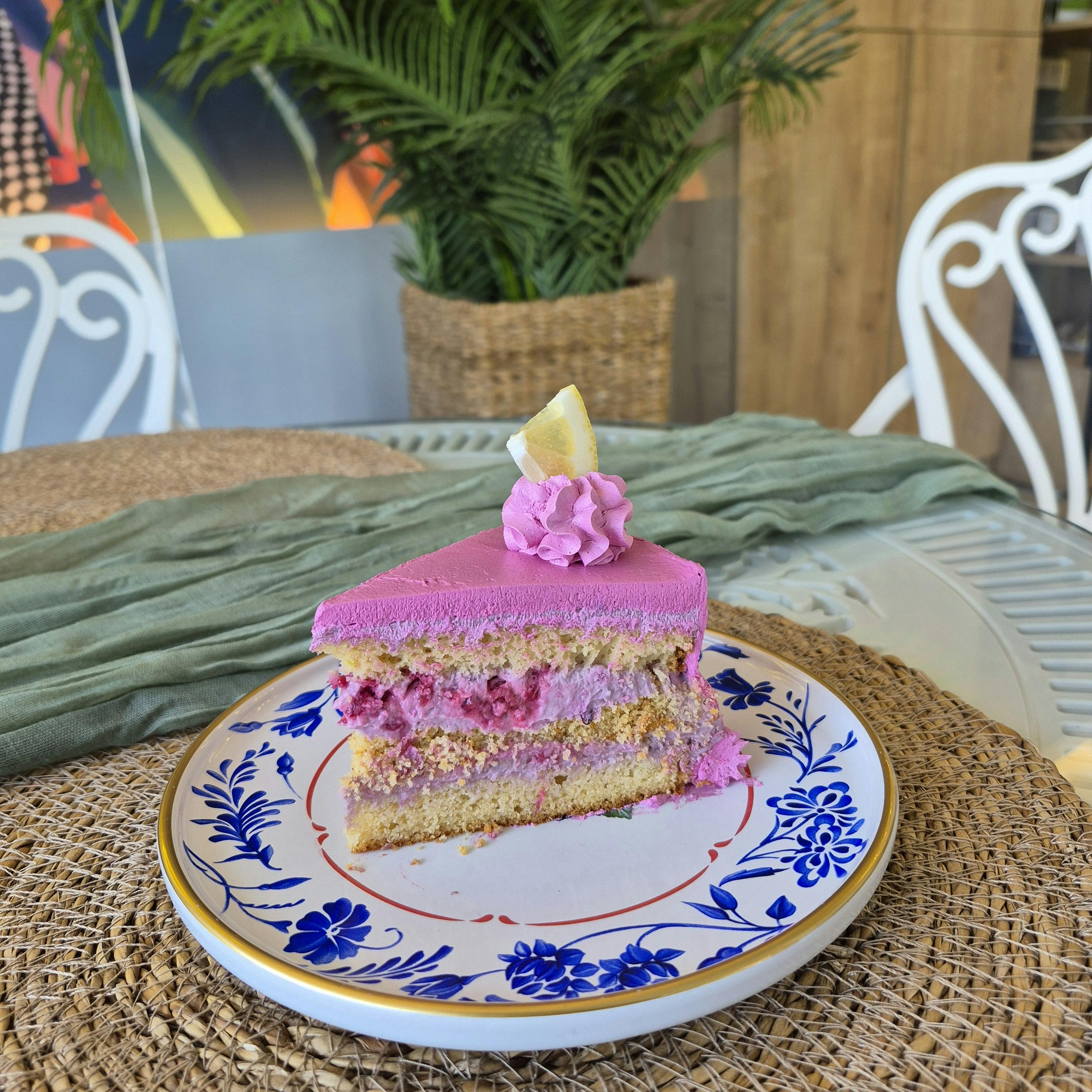 Pink Layer Cake Slice with Lemon Garnish · Free Stock Photo