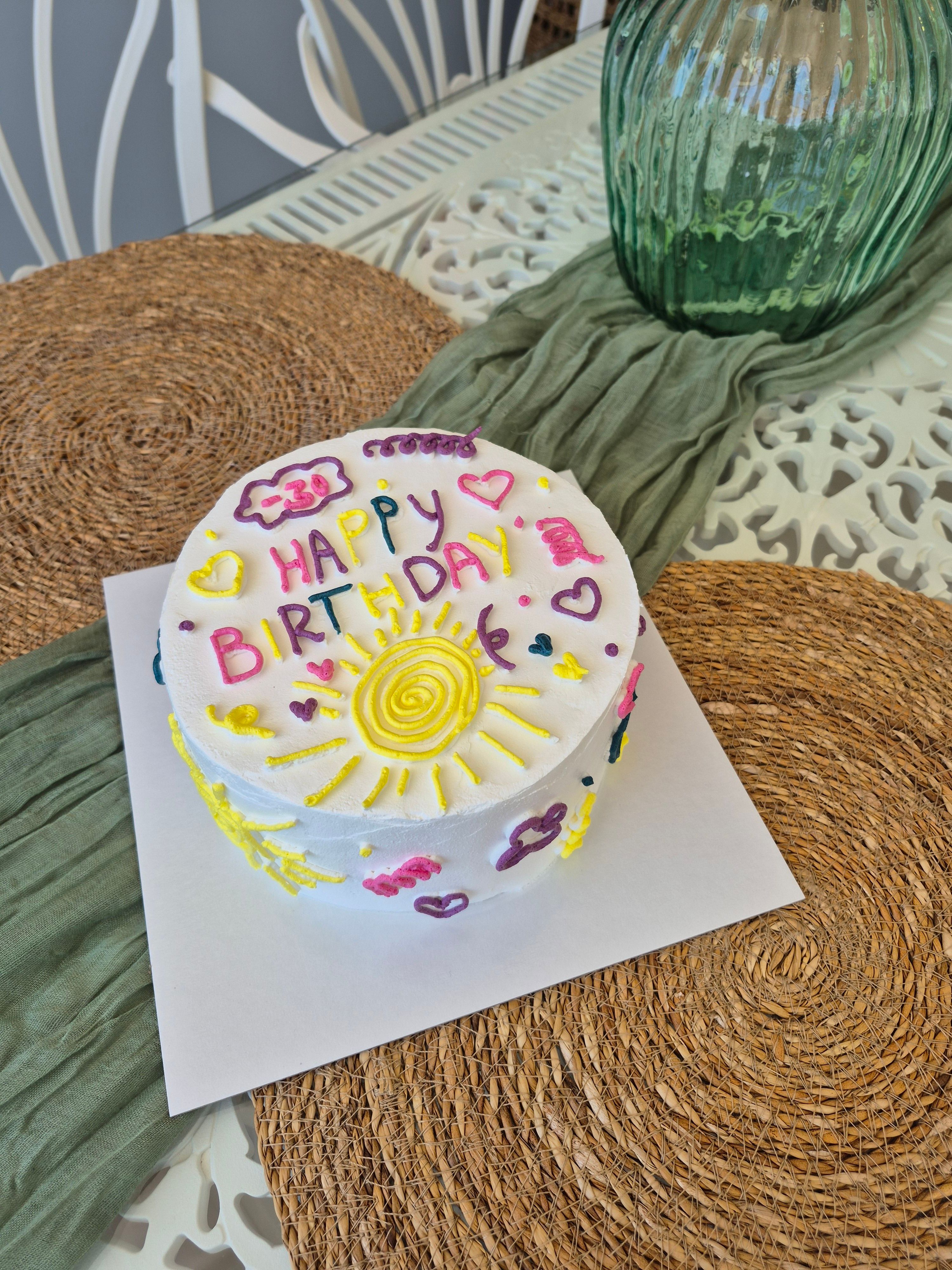 Colorful Birthday Cake on Decorative Table · Free Stock Photo