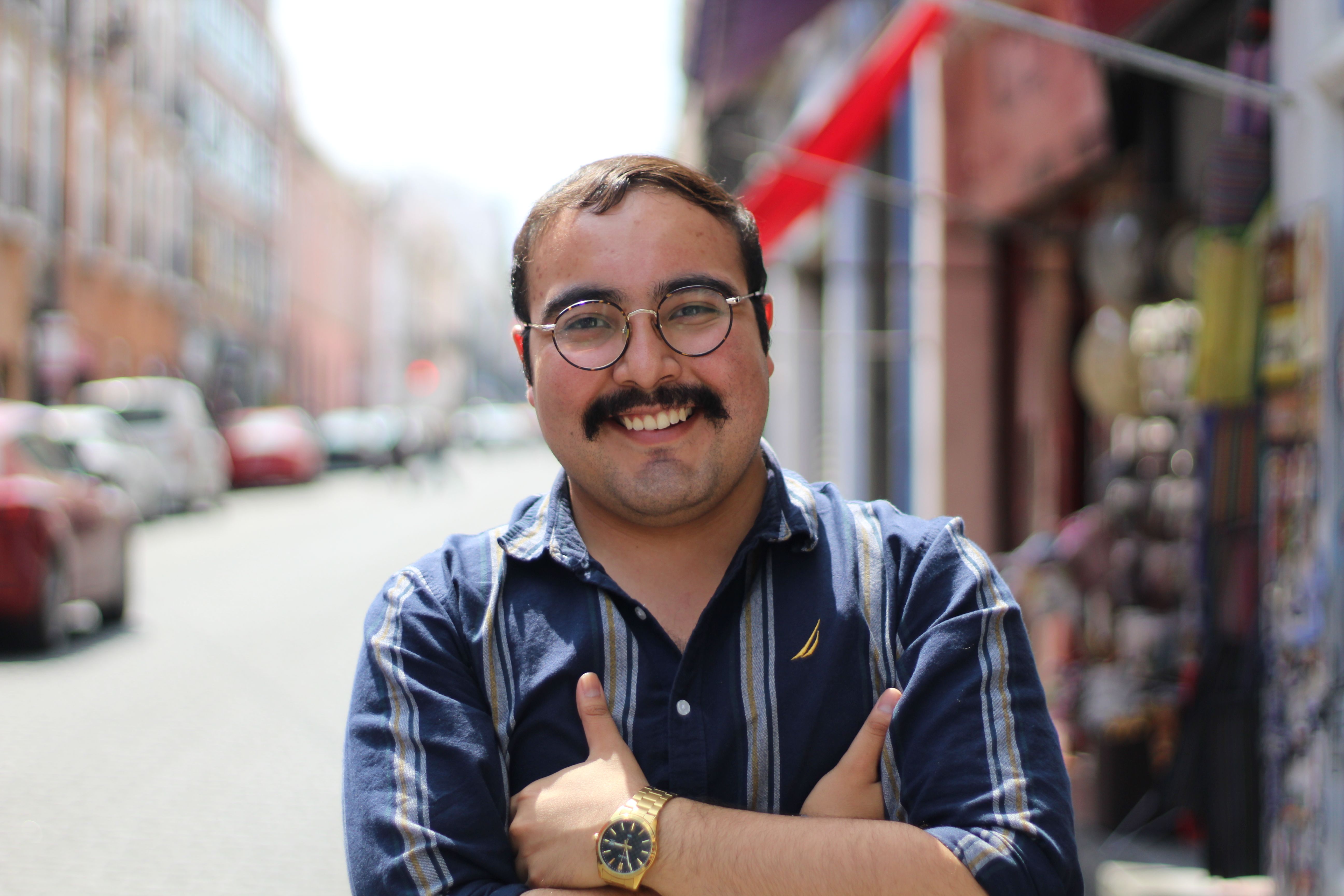 Smiling Man in Urban Street Setting · Free Stock Photo