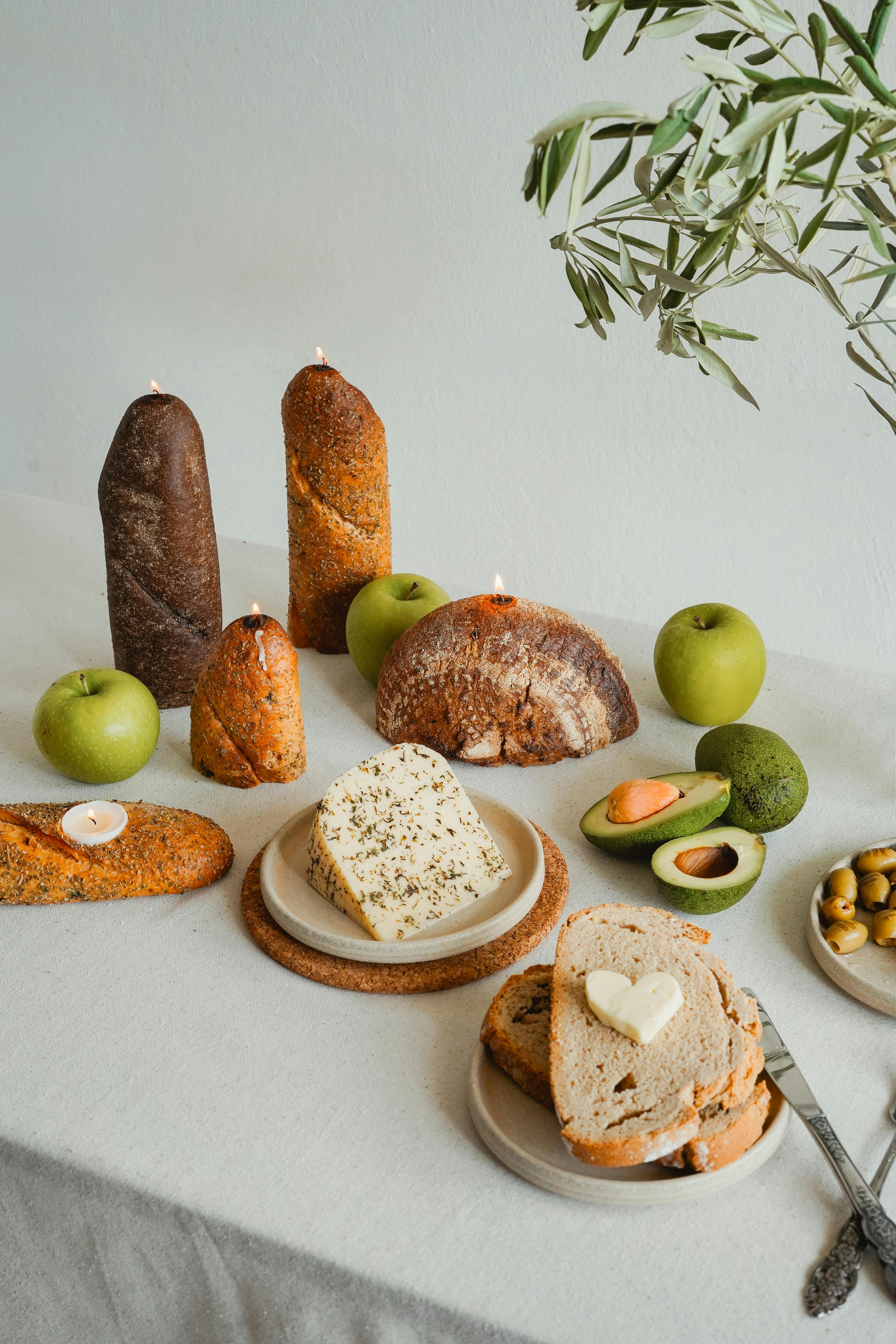 Rustic Bread and Fruit on a Dining Table · Free Stock Photo