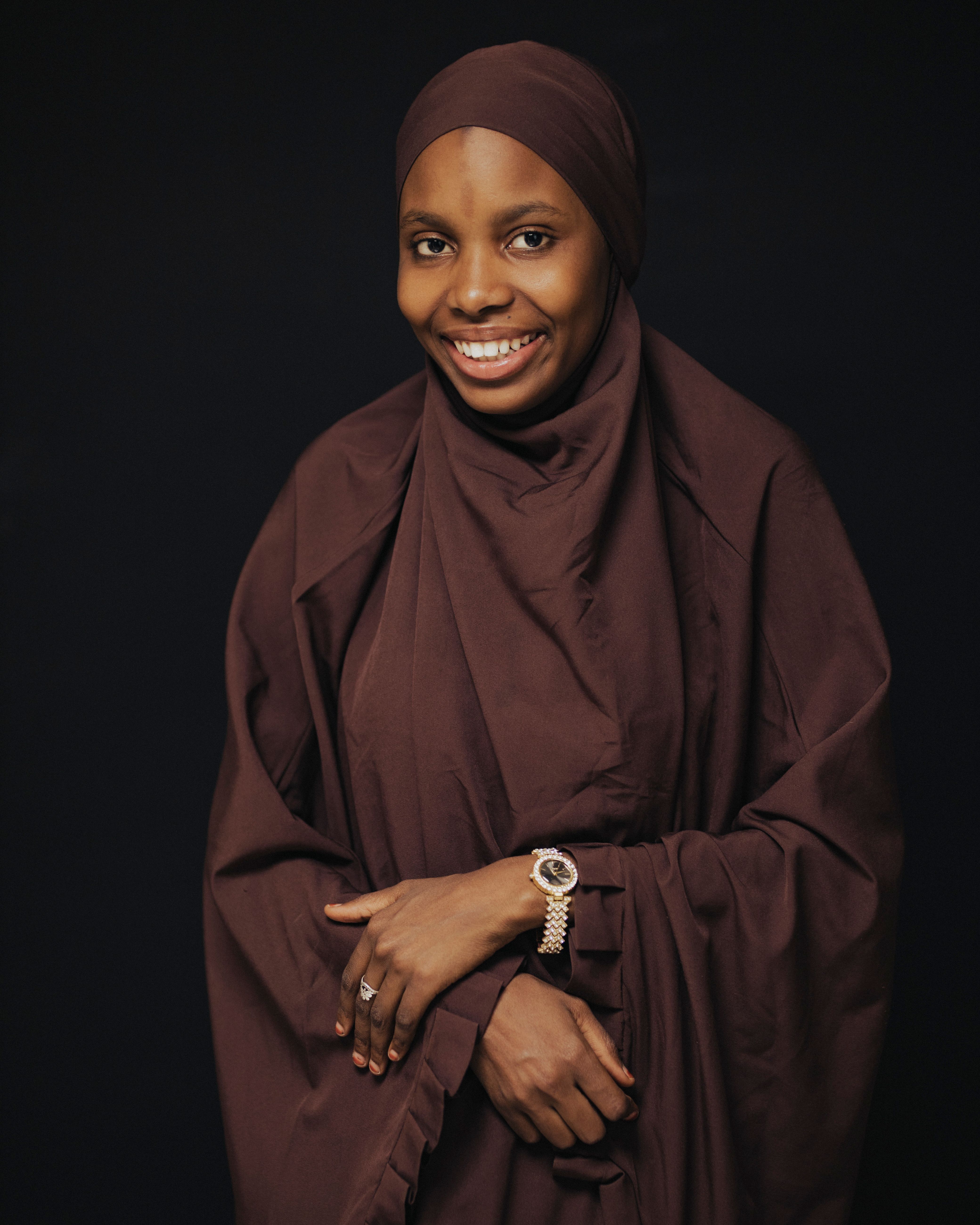 Smiling Woman in Hijab with a Watch Portrait · Free Stock Photo