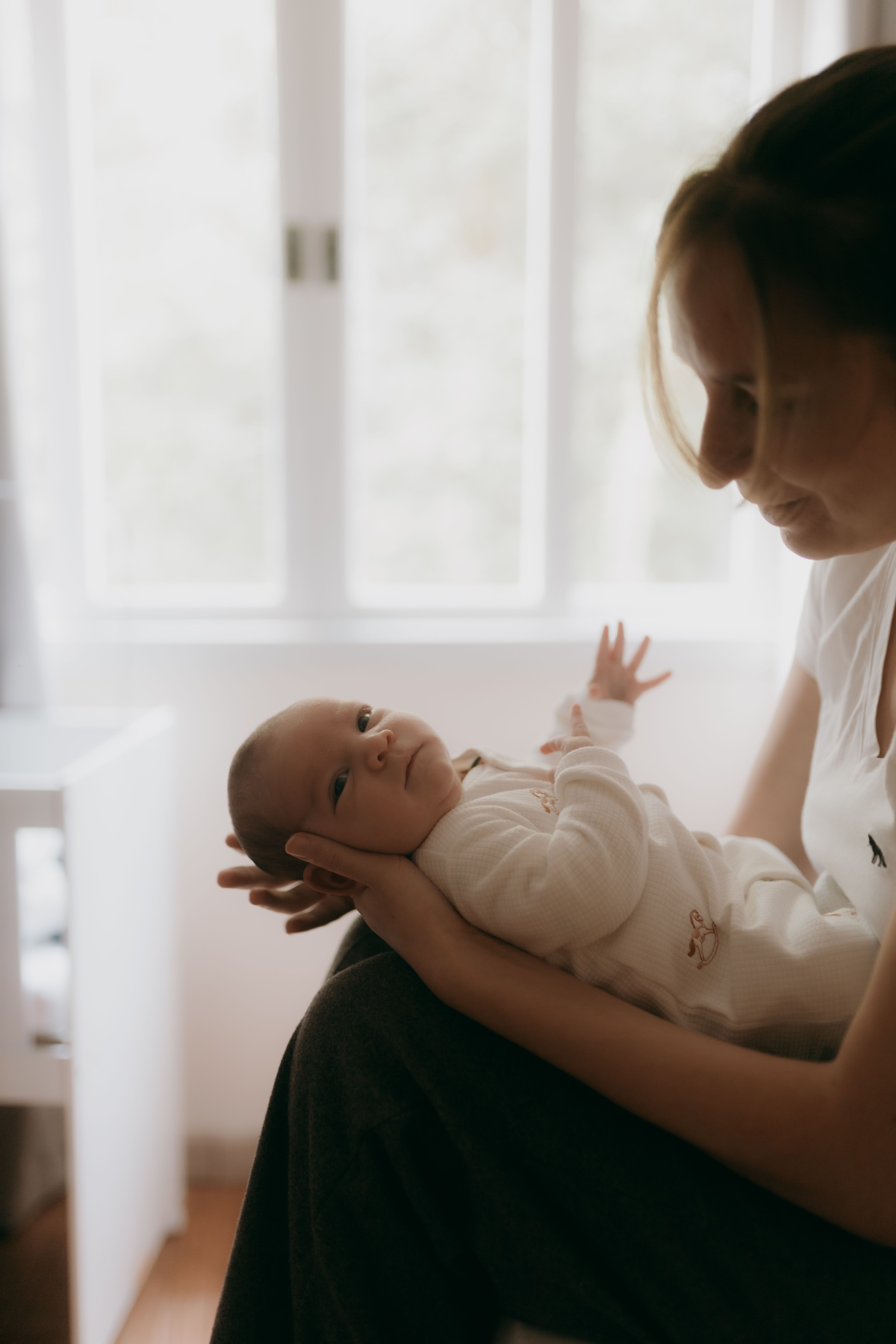 Mother and Baby Bonding in Sunlit Room · Free Stock Photo