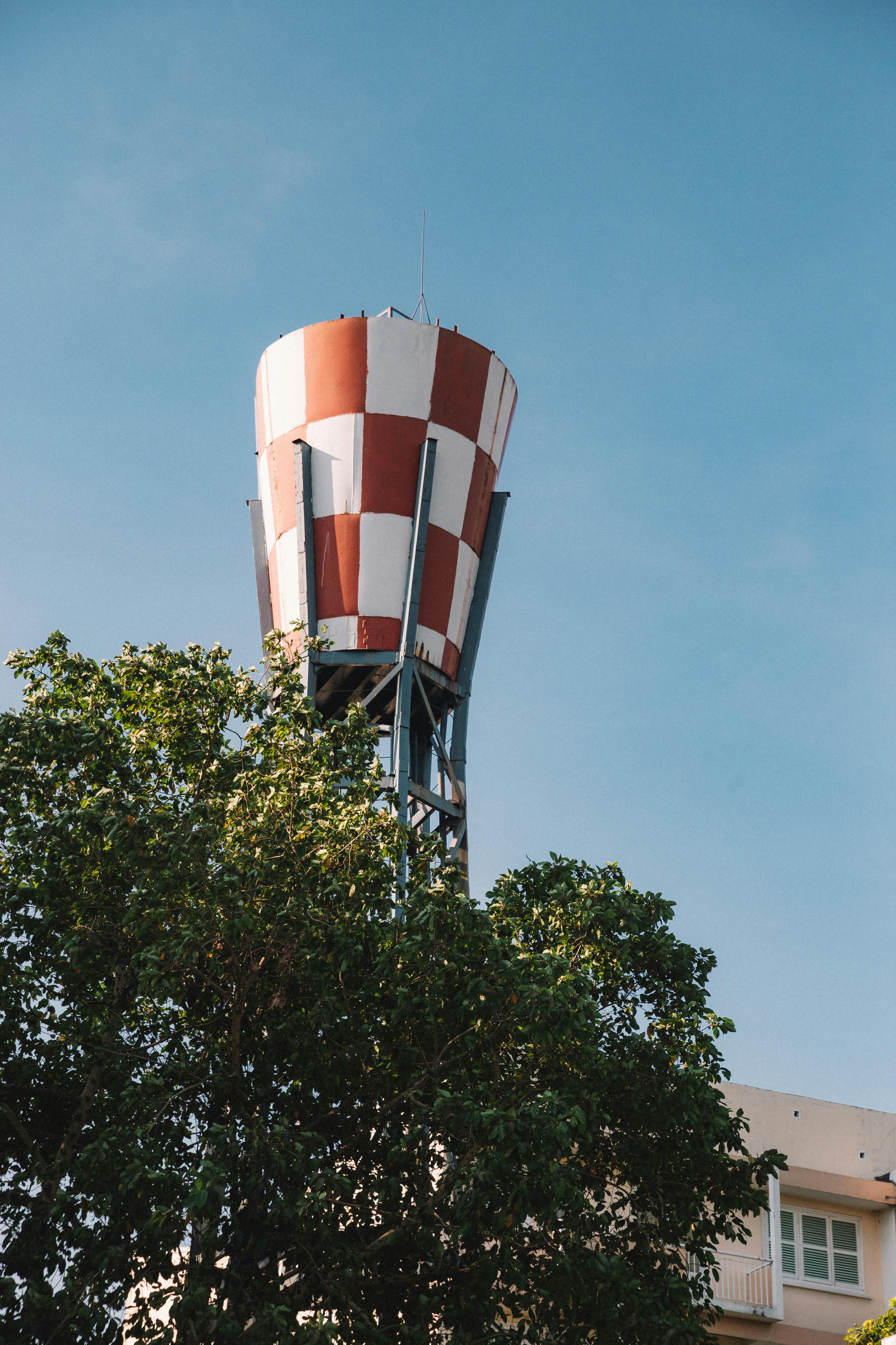 Tall Water Tower with Checkerboard Pattern Against Blue Sky · Free ...