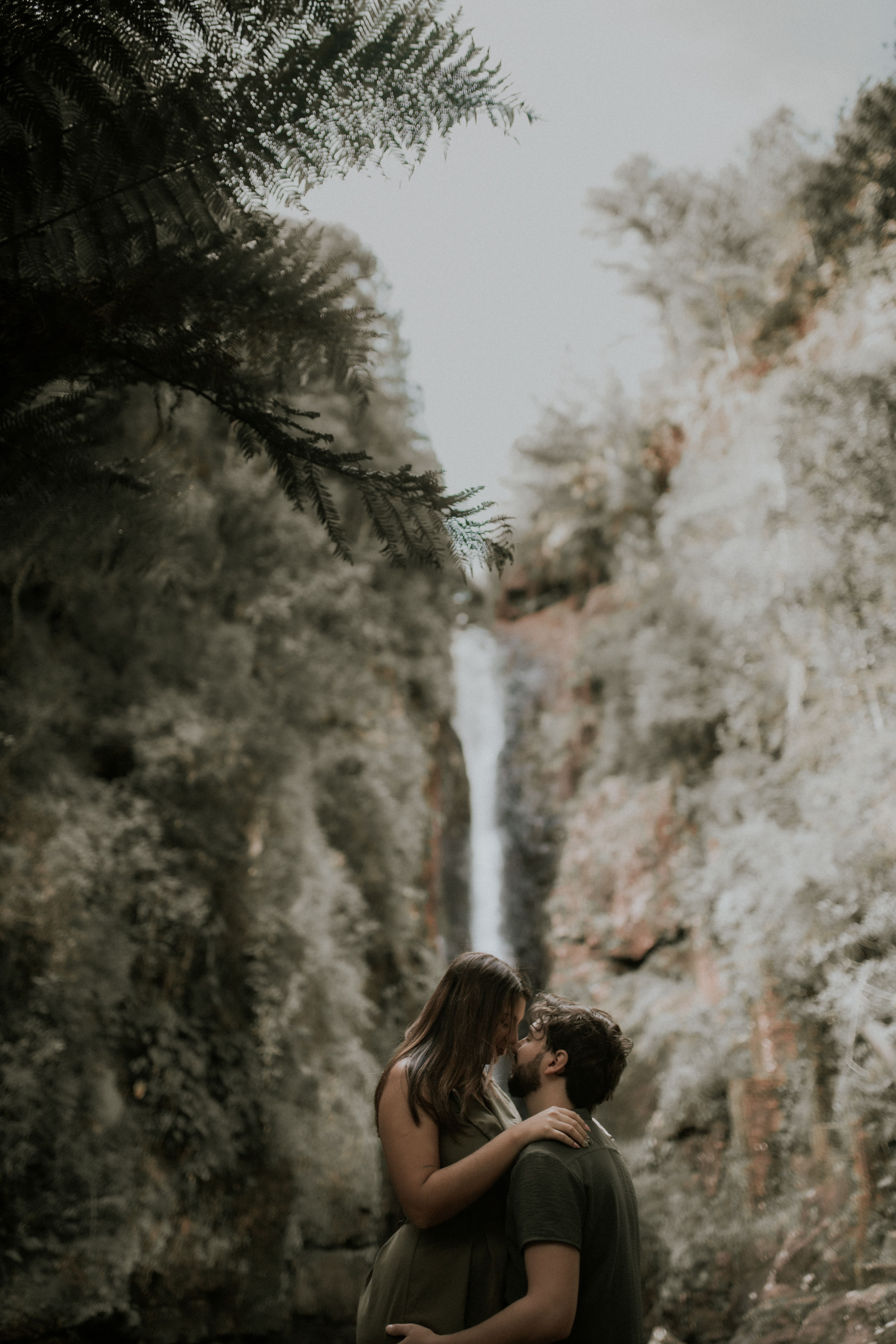 Romantic Couple Embracing by Waterfall · Free Stock Photo