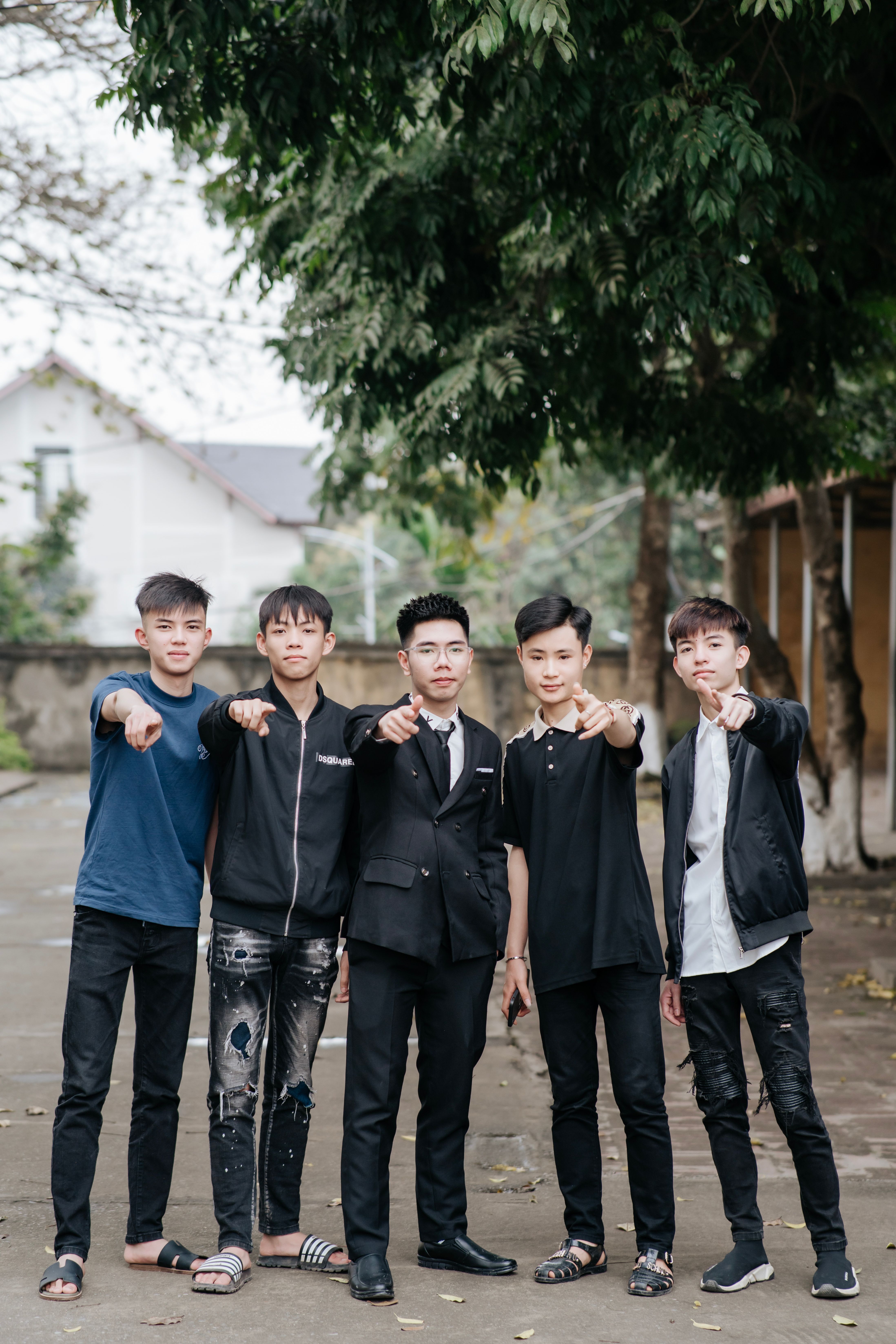 Group of Teen Boys Posing Together Outdoors · Free Stock Photo