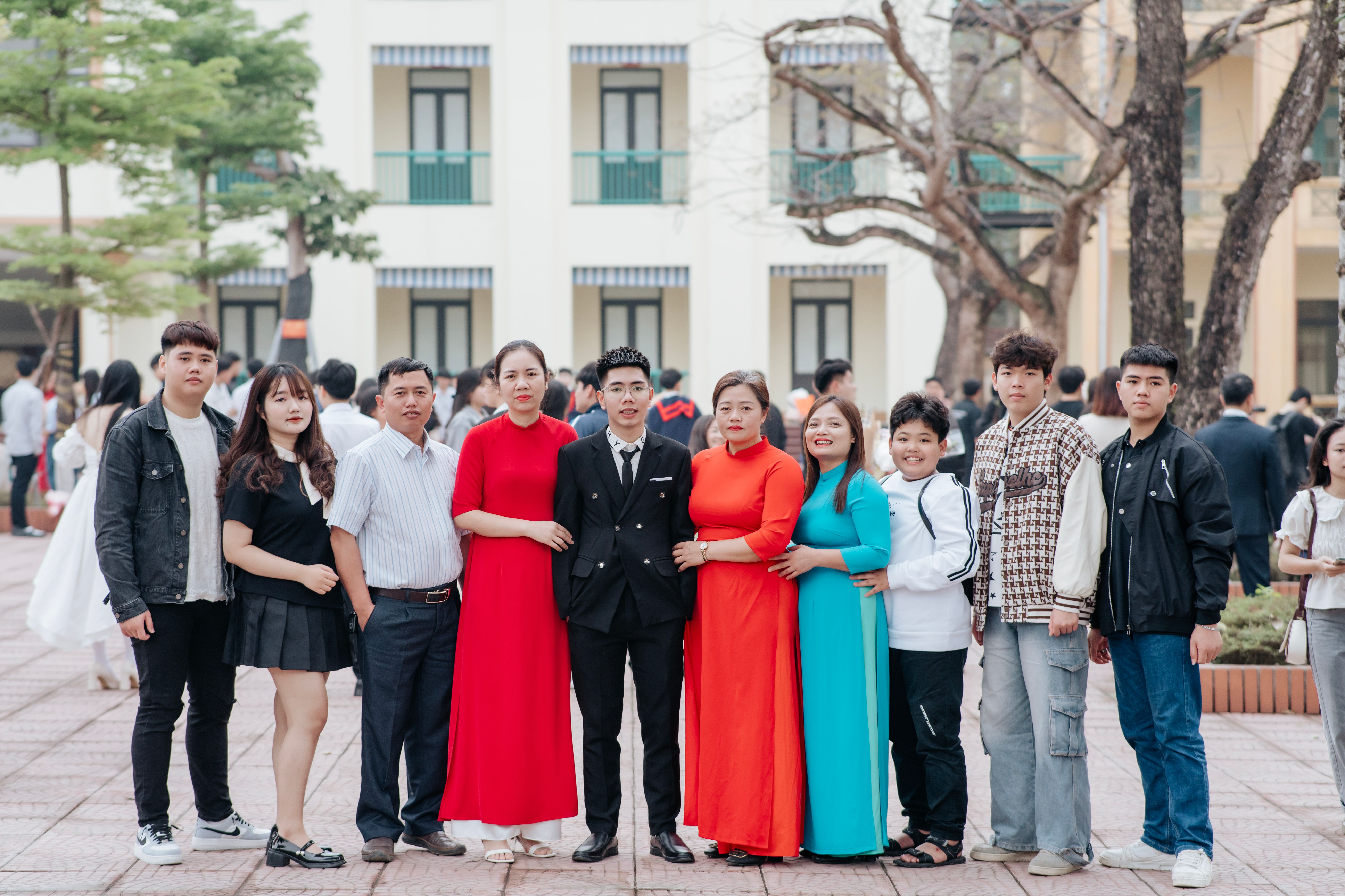 Group Portrait of Family Outdoors in Colorful Attire · Free Stock Photo