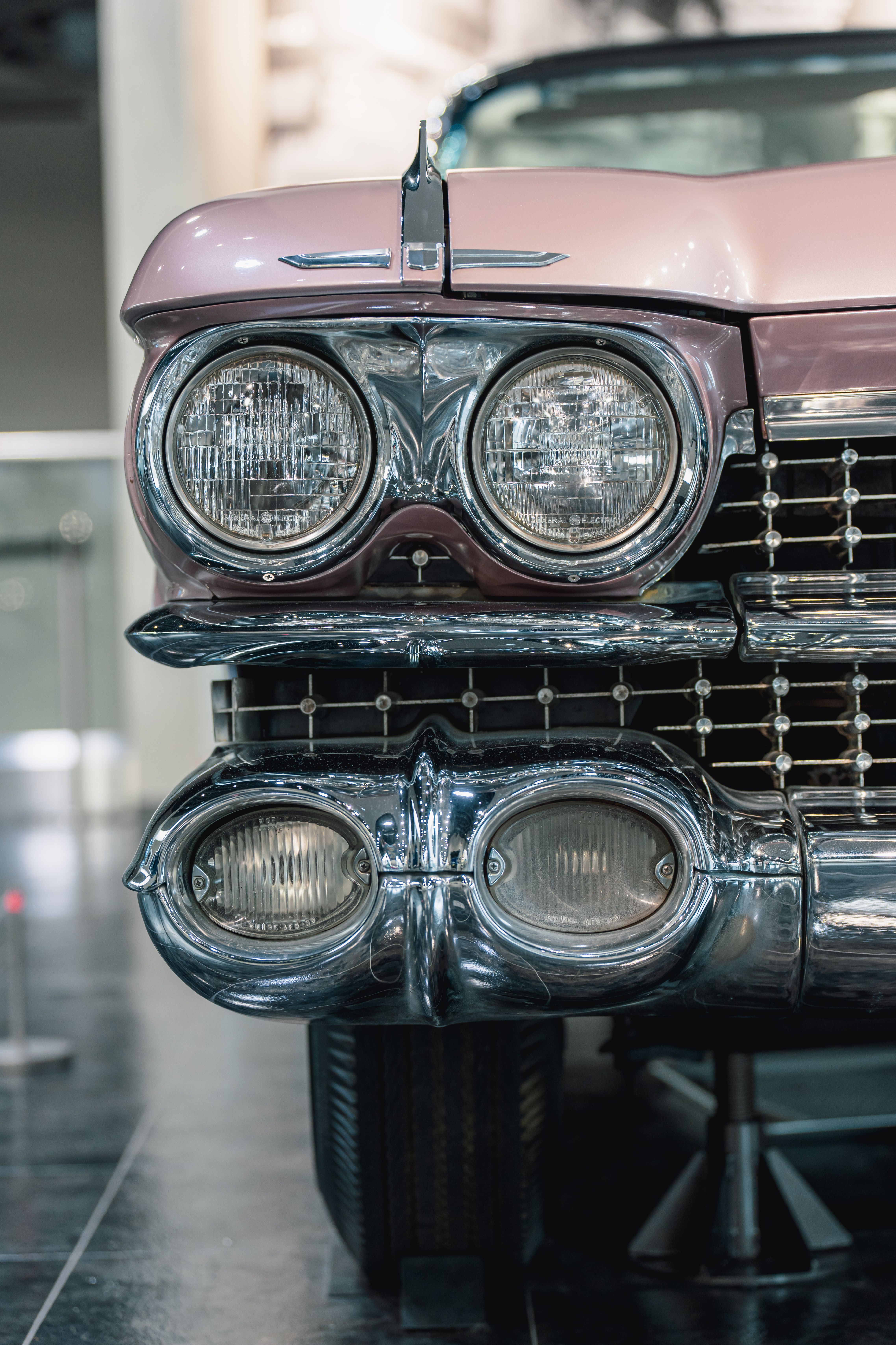 Close-Up of Classic Pink Car Headlights · Free Stock Photo