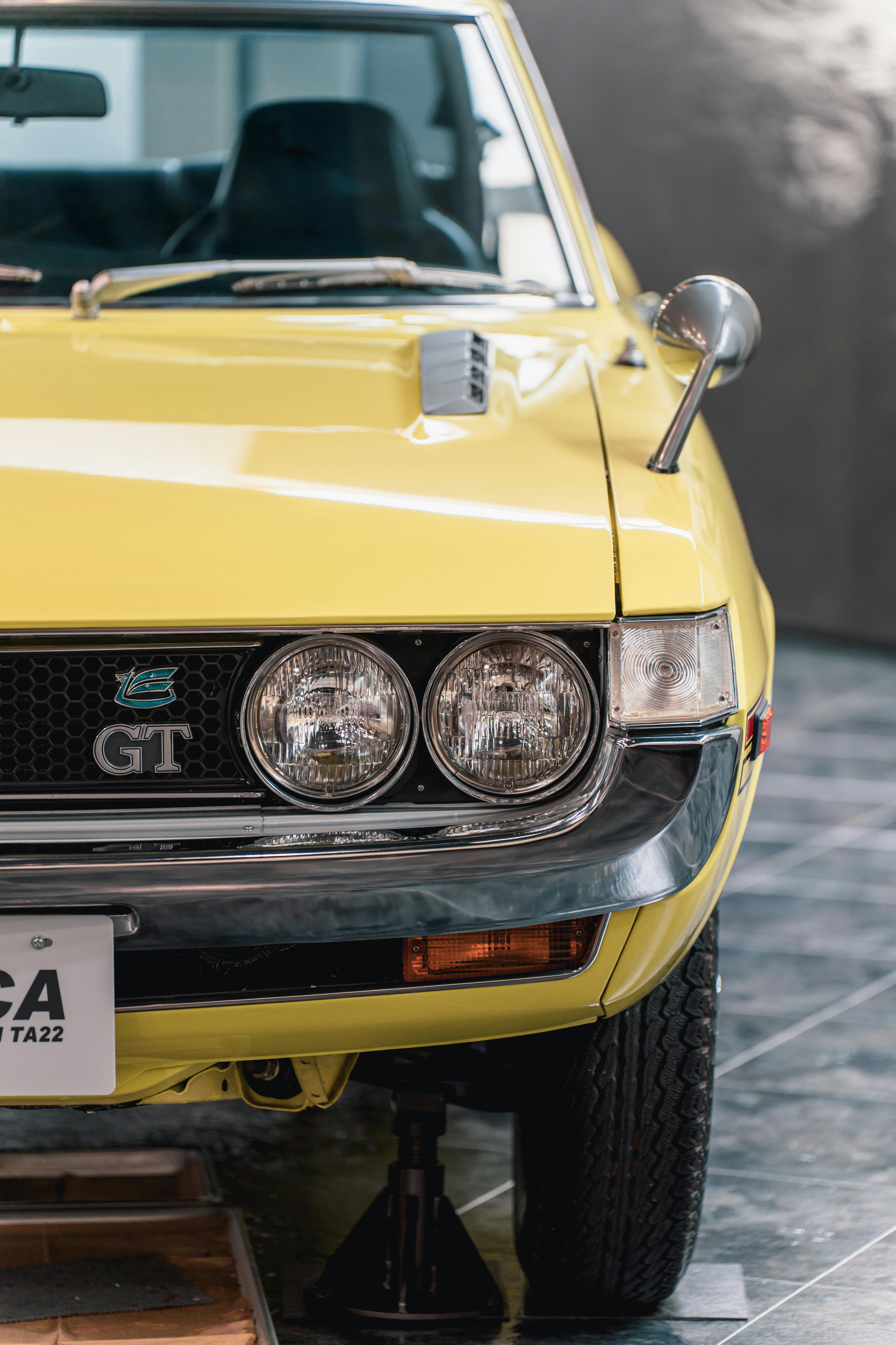 Close-up of Vintage Yellow Car Front · Free Stock Photo