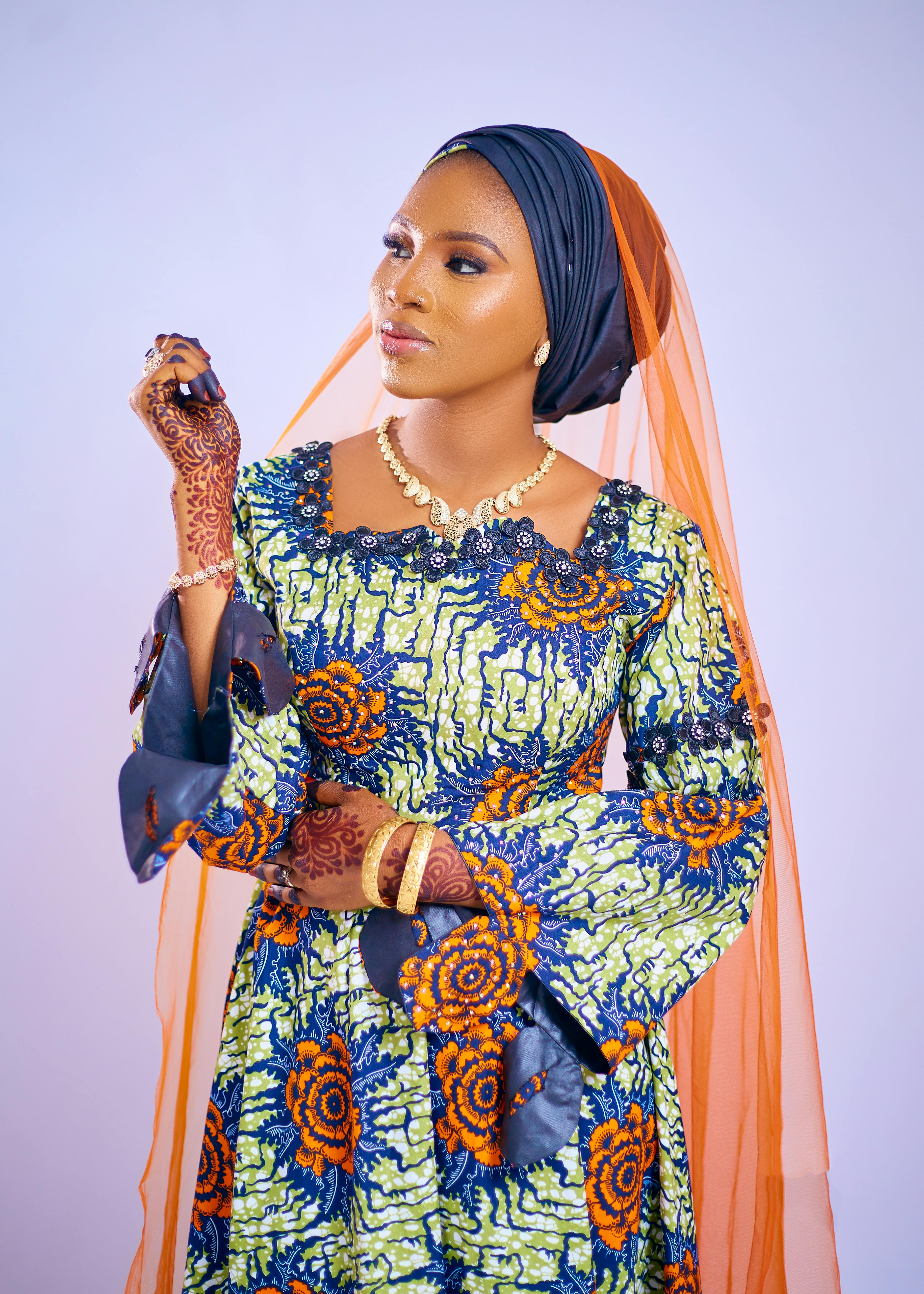 Traditional African Attire with Henna Art · Free Stock Photo