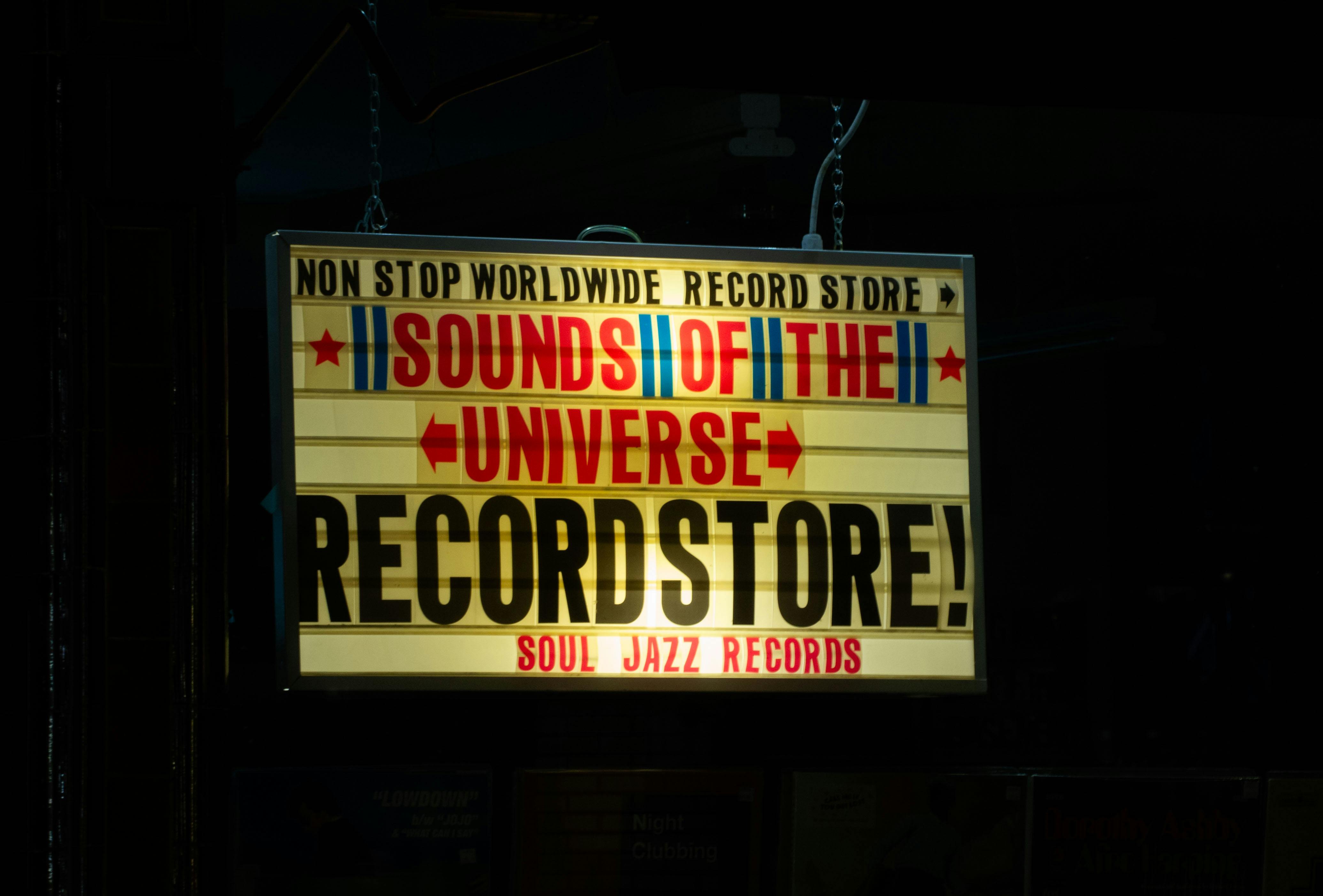 Illuminated Record Store Sign in London · Free Stock Photo