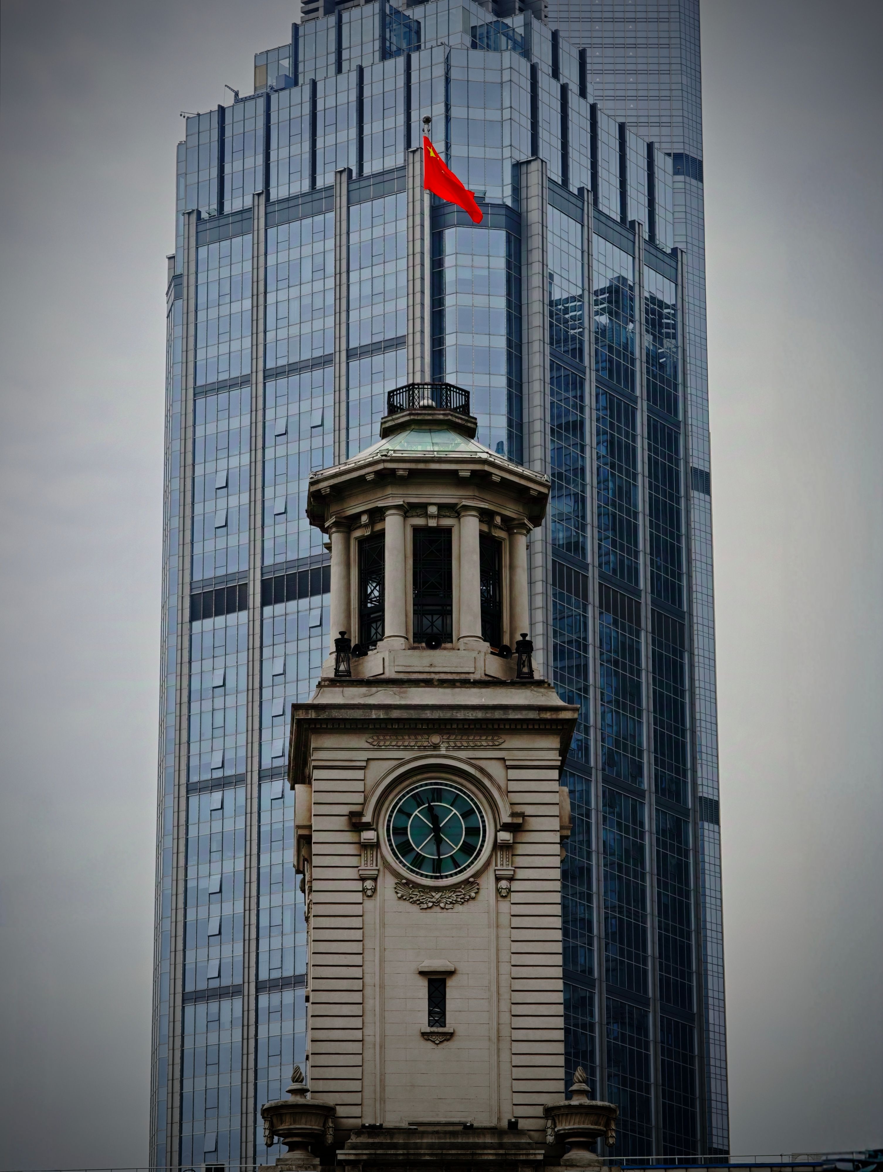 Historic Clock Tower with Modern Skyscraper Backdrop · Free Stock Photo