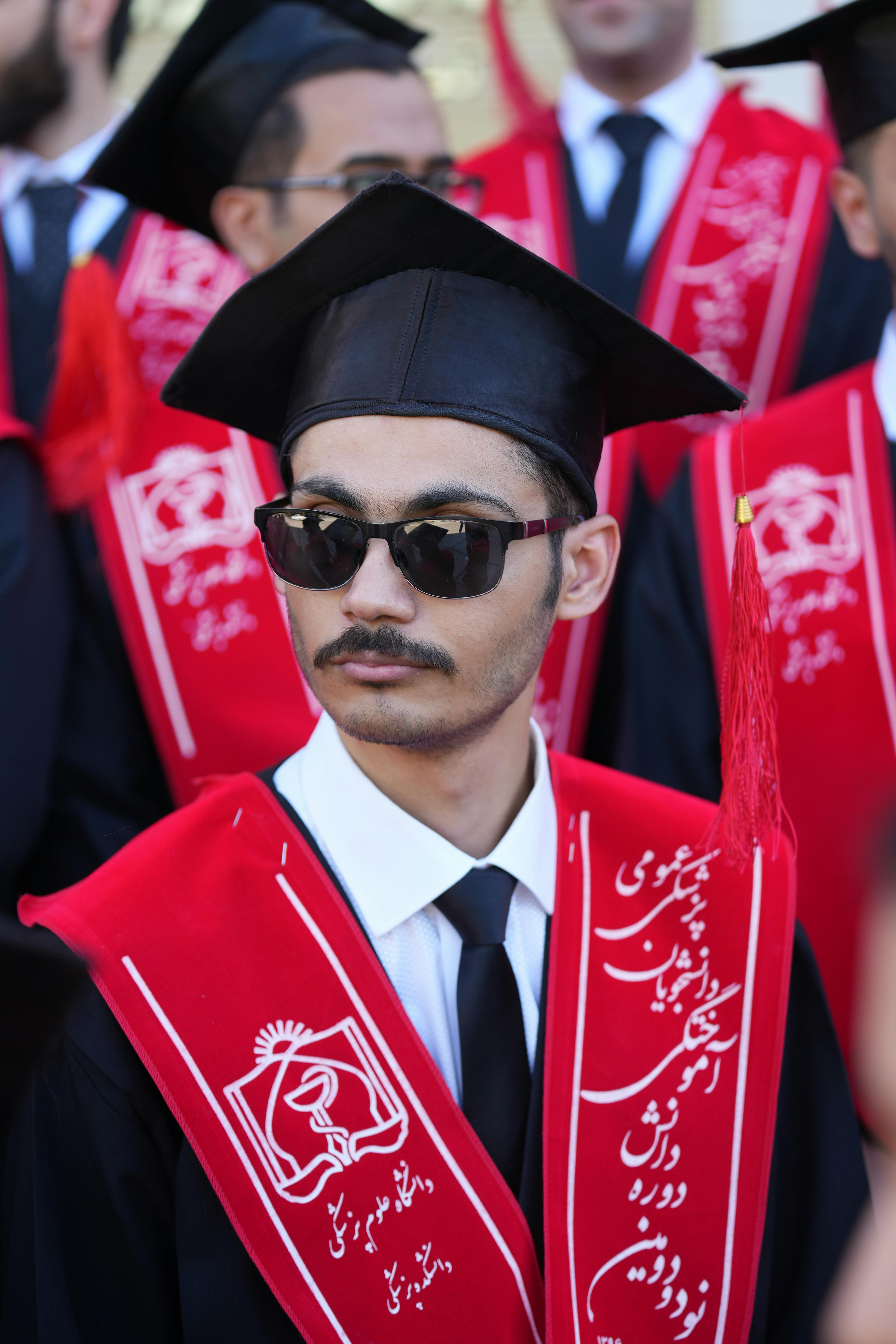 Graduation Ceremony with Persian Script Sashes · Free Stock Photo