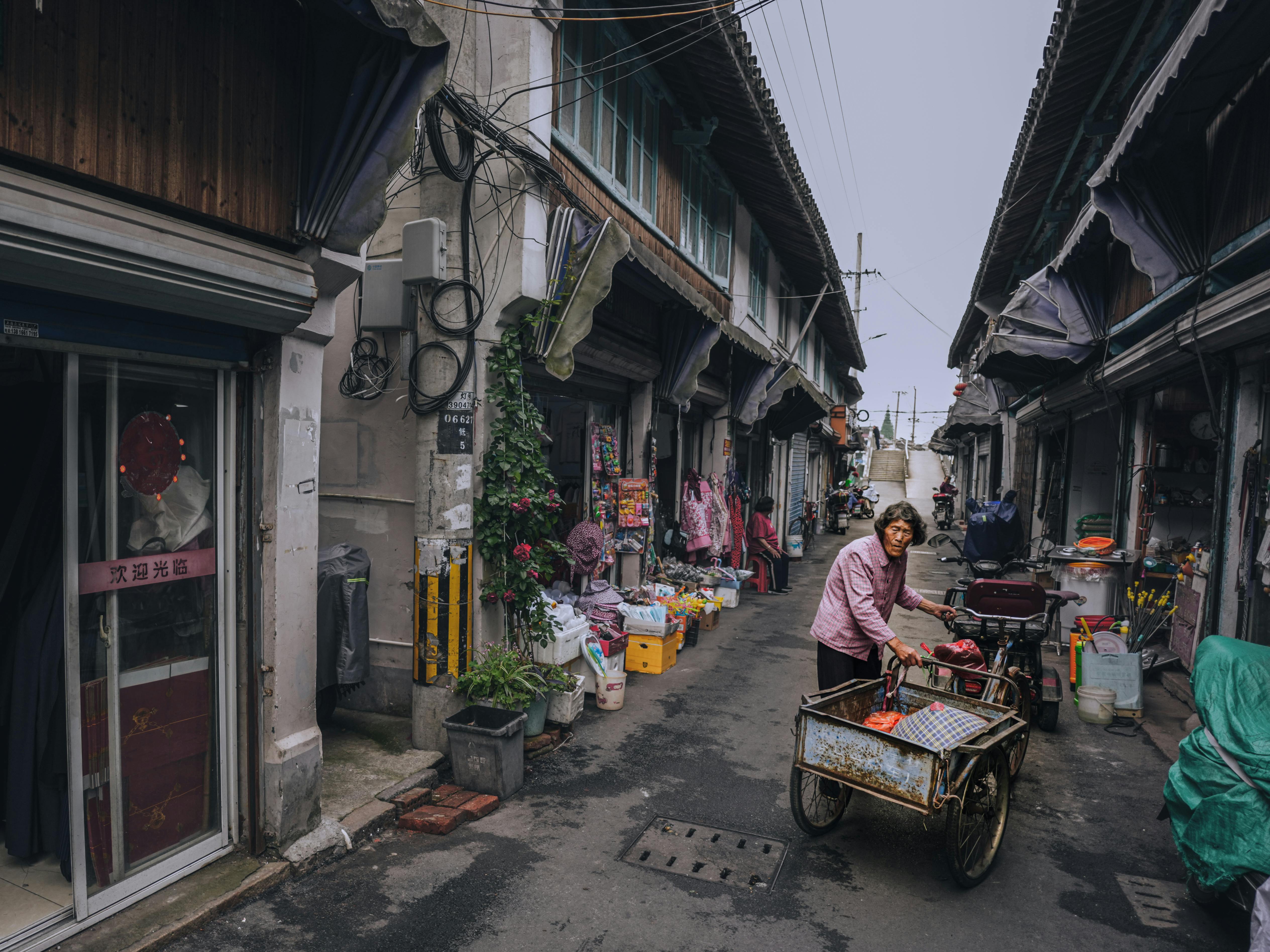 Traditional Market Street Scene with Local Vendor · Free Stock Photo
