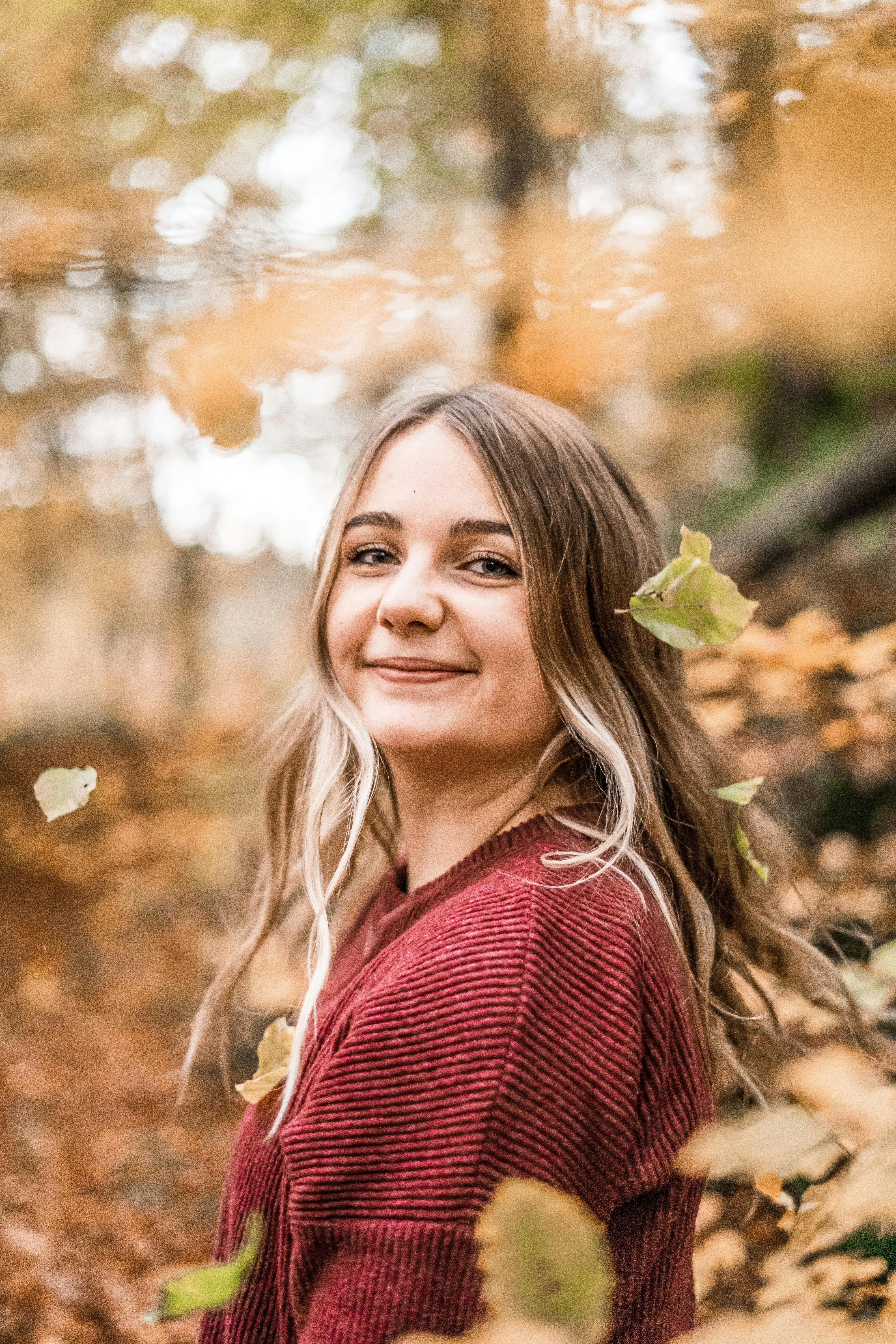 Photo Of Woman Wearing Red Sweater · Free Stock Photo