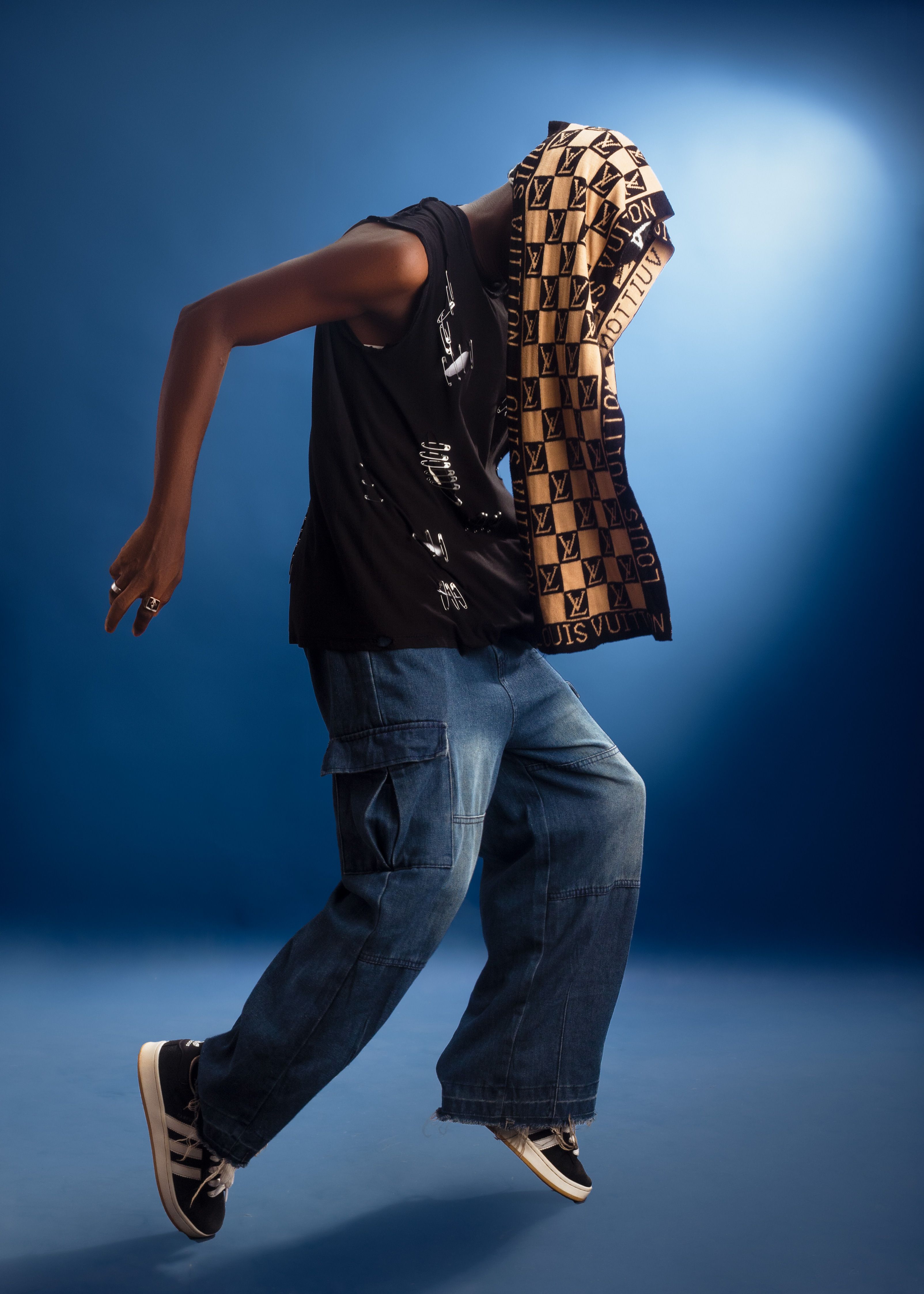 Contemporary Black Fashion Model in Dynamic Pose · Free Stock Photo