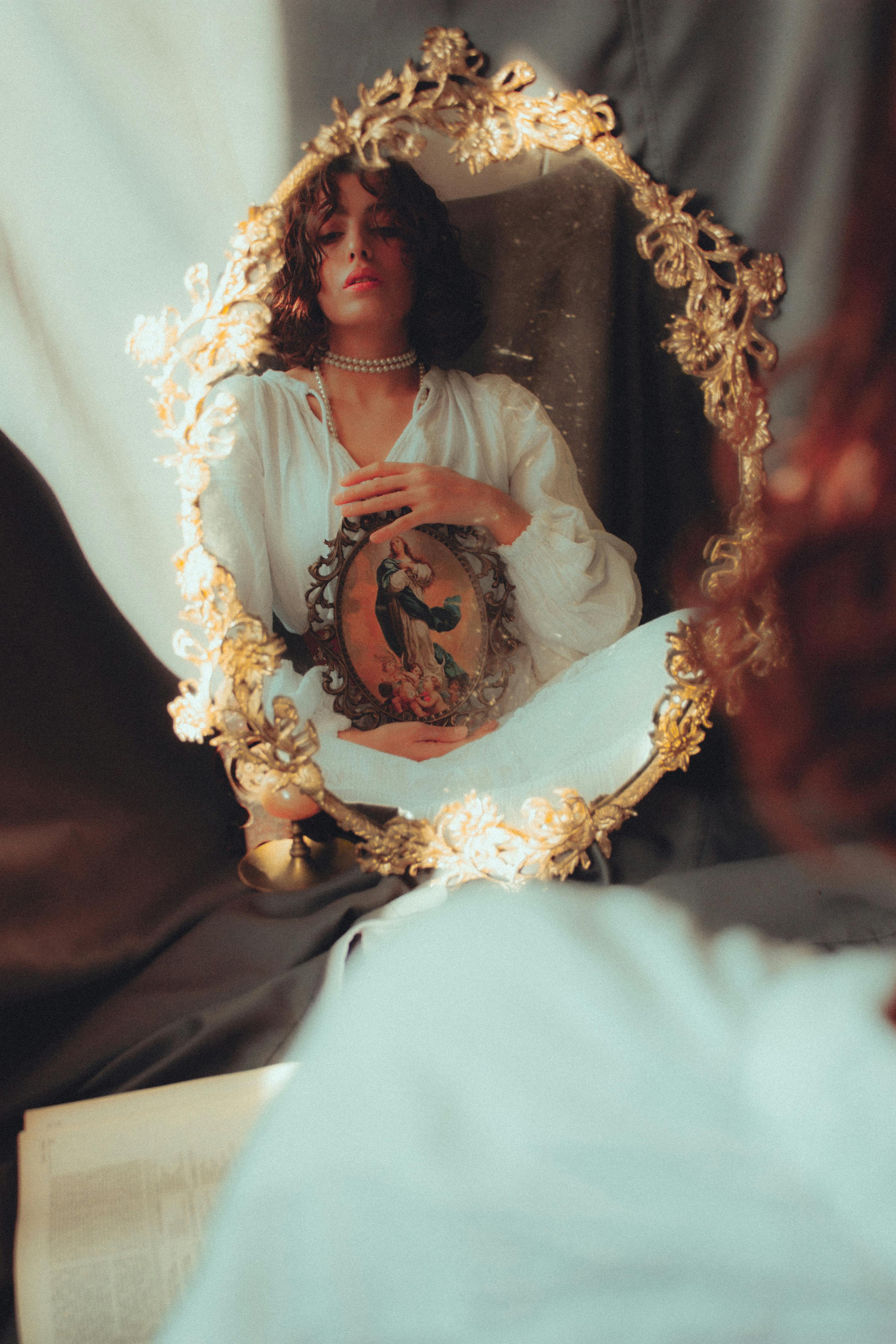 Elegant Woman in Vintage Mirror Reflection · Free Stock Photo