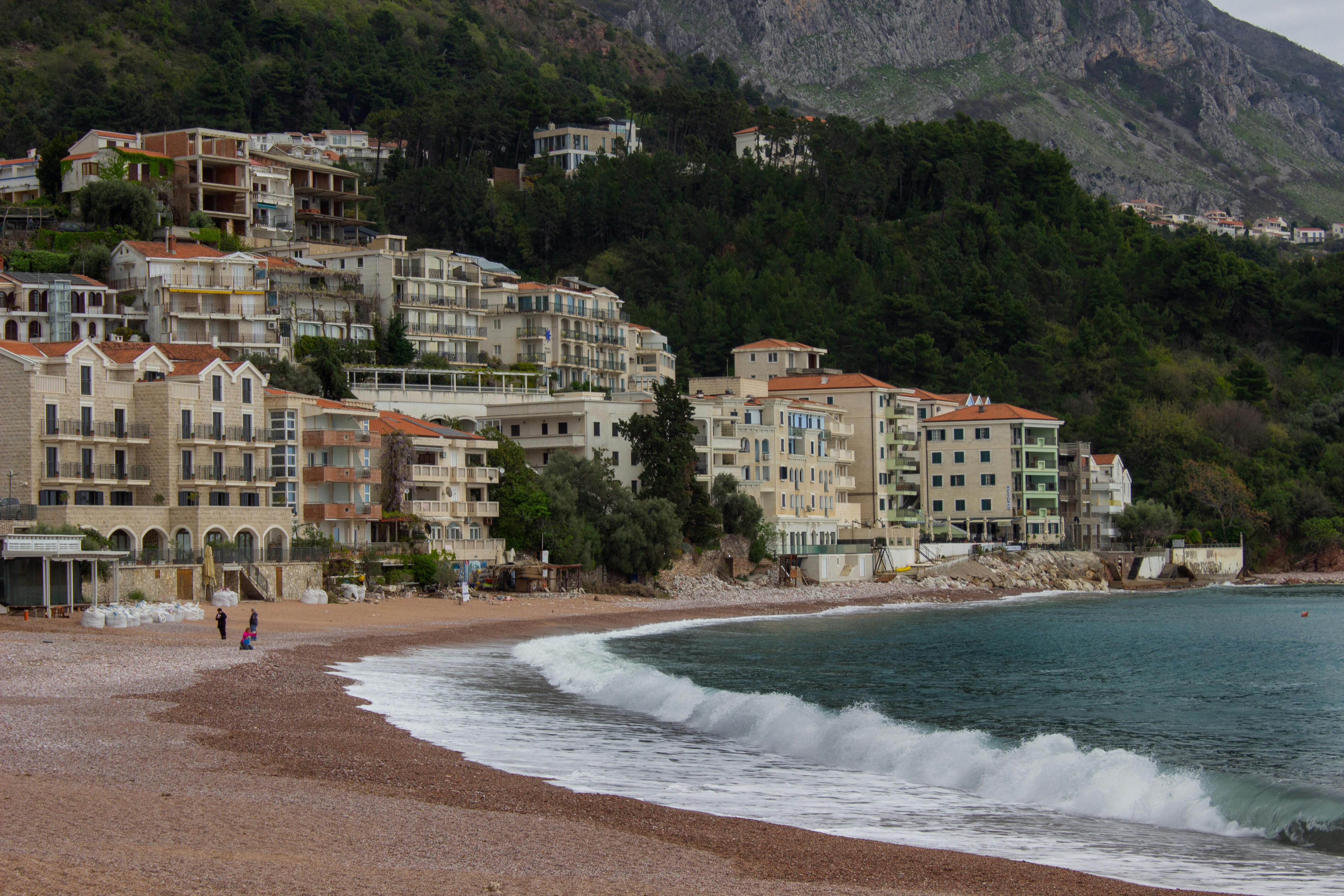Coastal Mediterranean Town Against Mountains · Free Stock Photo