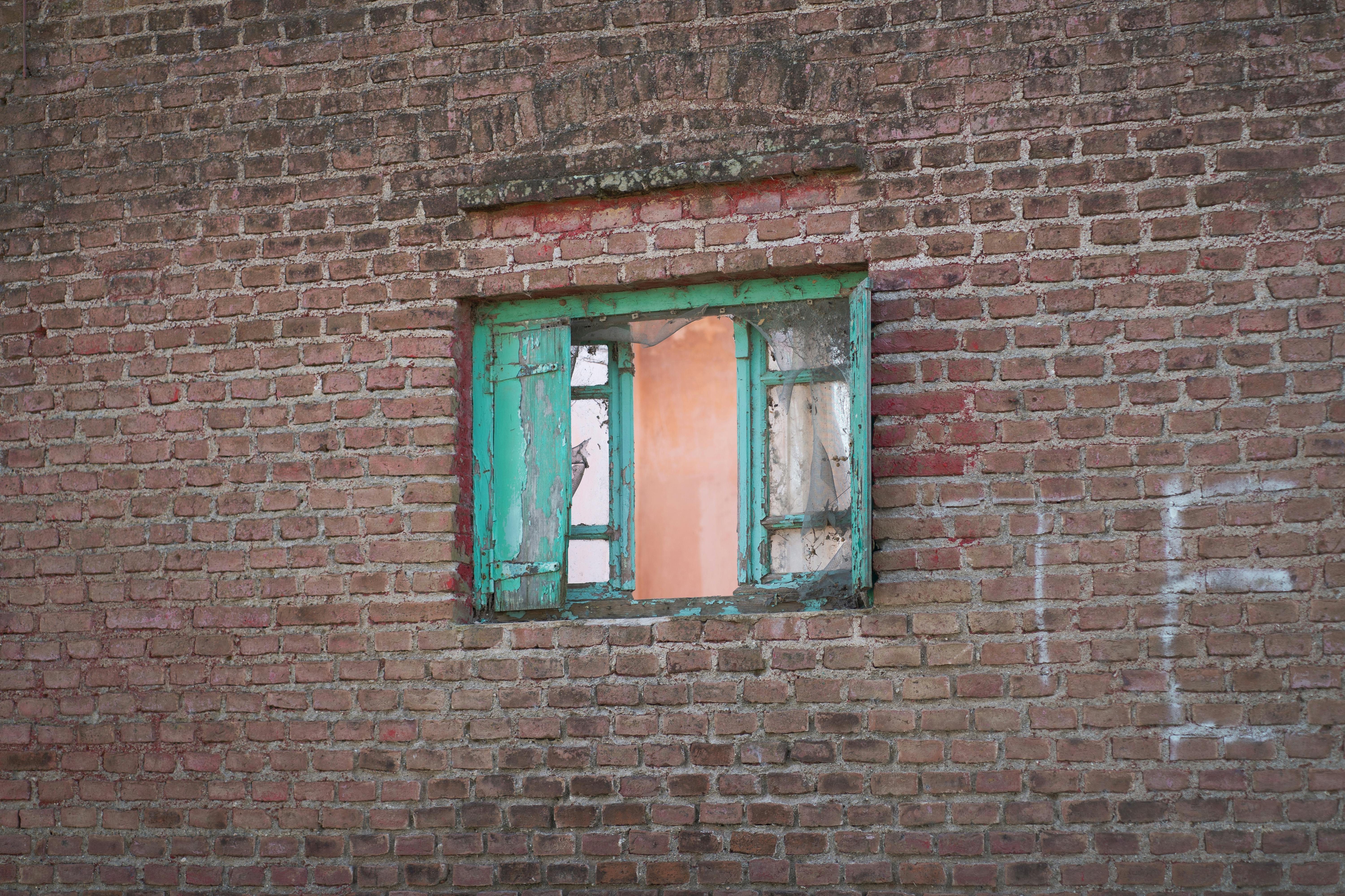 Rustic Brick Wall with Weathered Window in Córdoba · Free Stock Photo